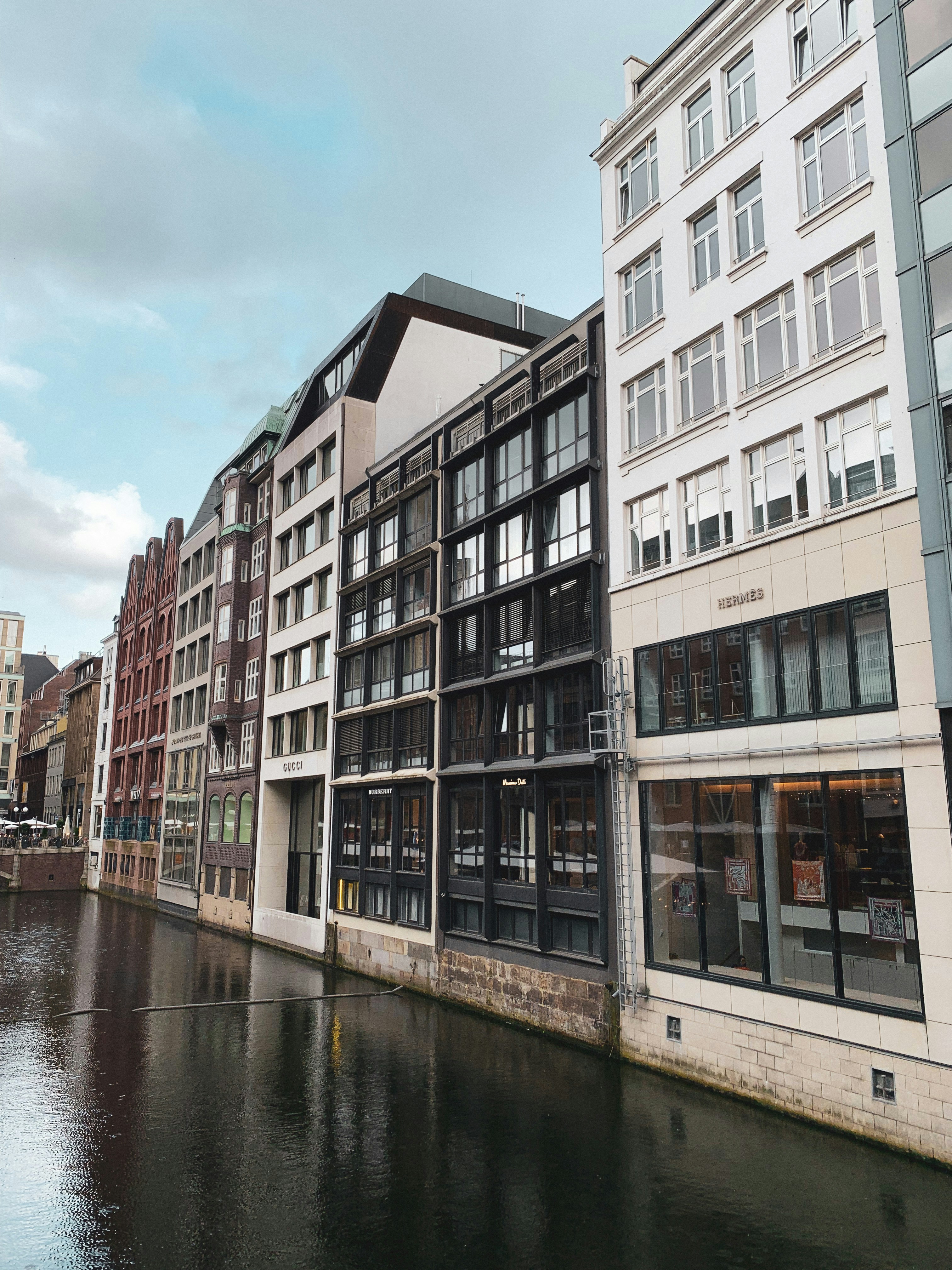 Canal Facades in Frame: Modern Glass and Brick Along the Water