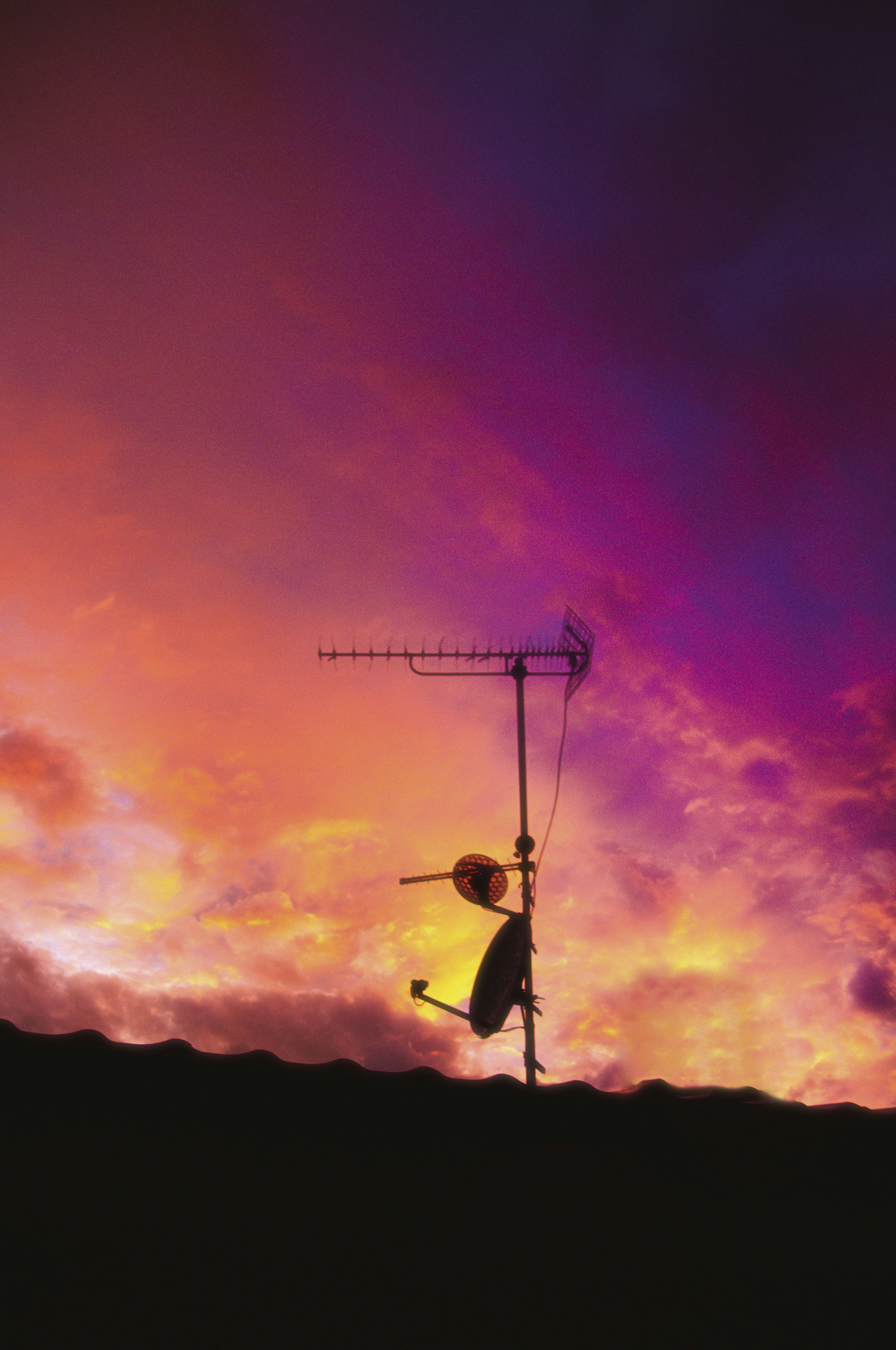 Silhouette on the Rooftop: A Dusk Anthem of Color and Static Signals