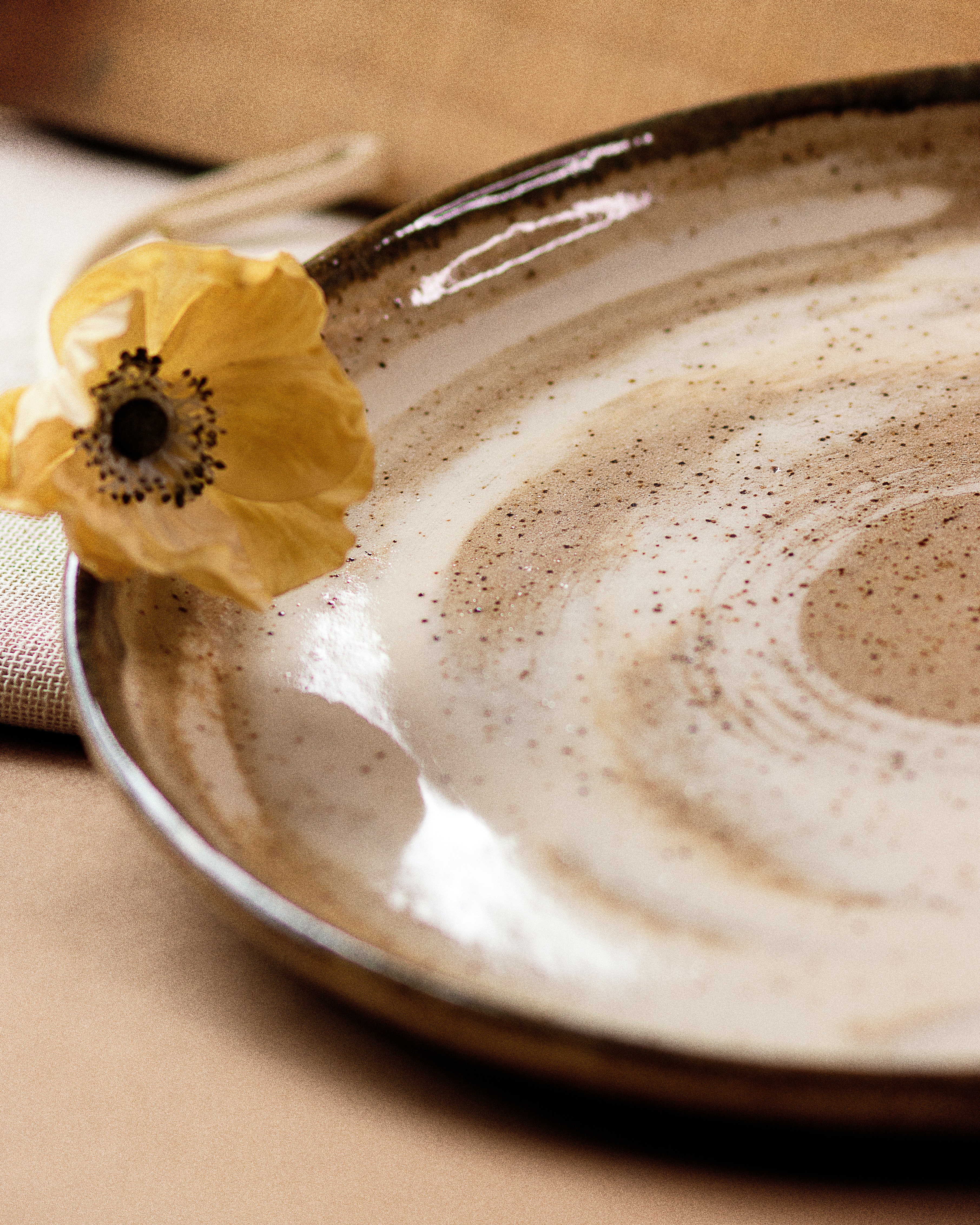 Pottery with simple earth tone backdrops. Wood and Ceramics.