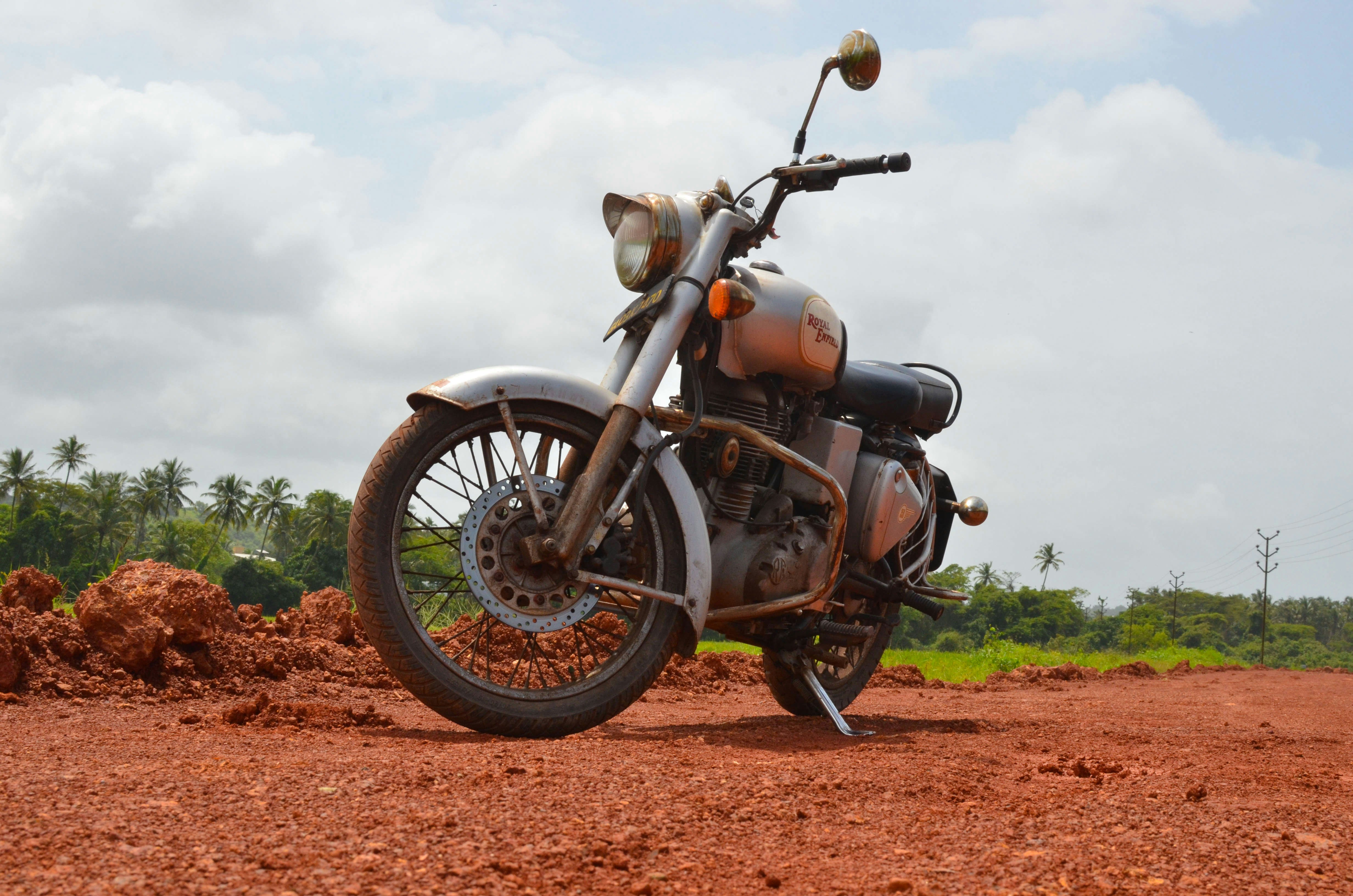 Black and gray motorcycle on brown dirt road during daytime photo ...