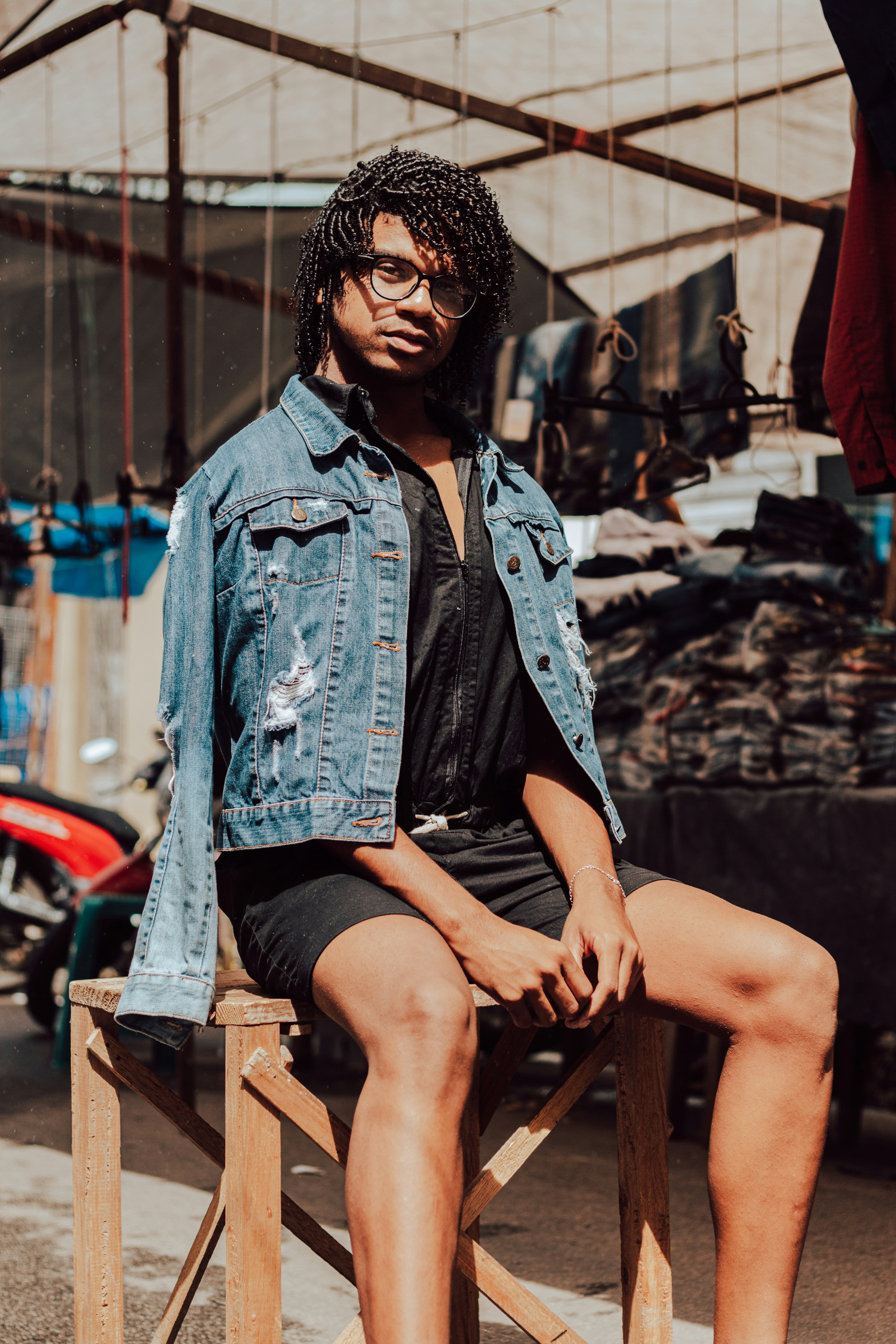 Denim Confidence: Portrait Under Market Canopies