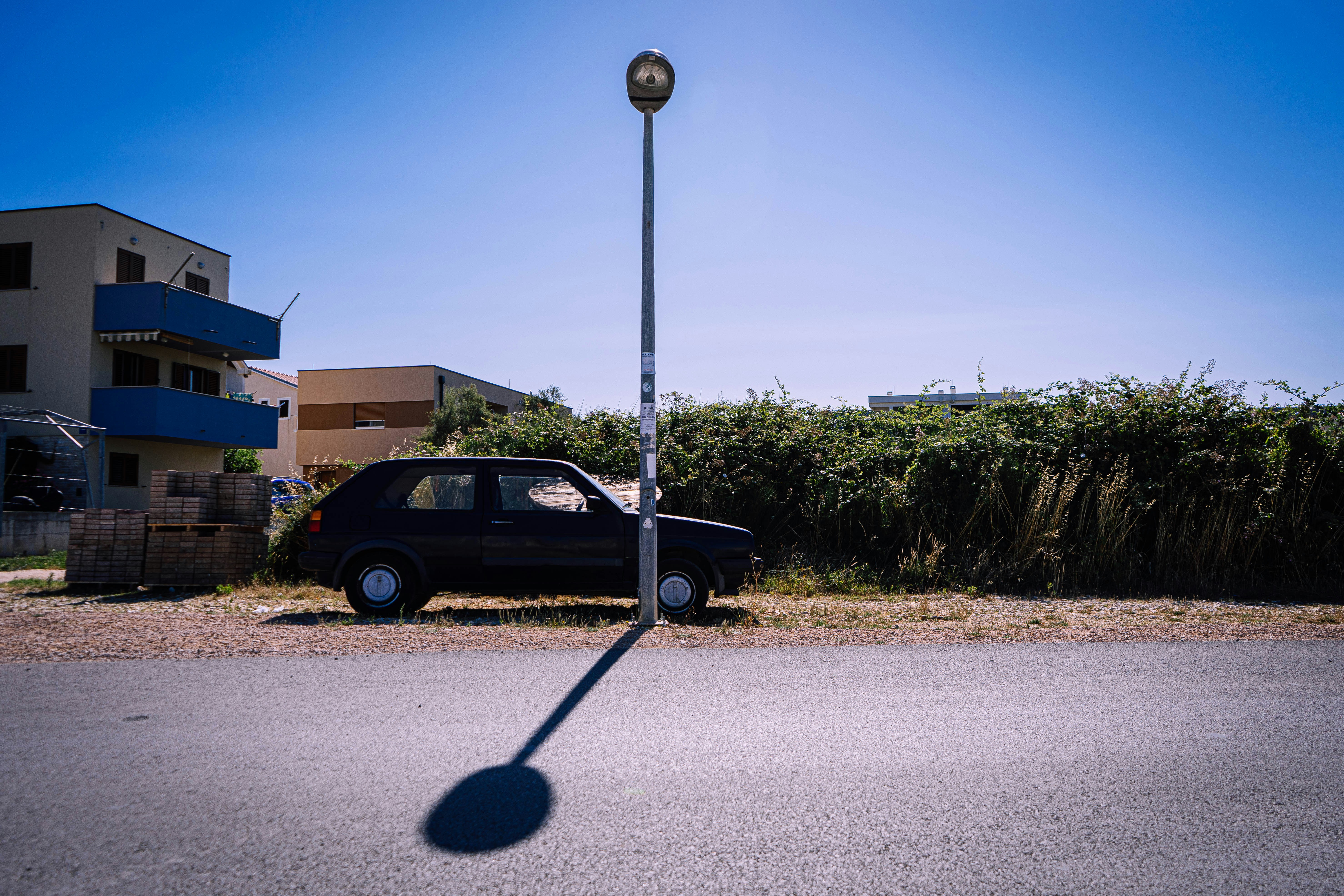 Black suv parked on gray concrete road during daytime photo – Free Nin ...
