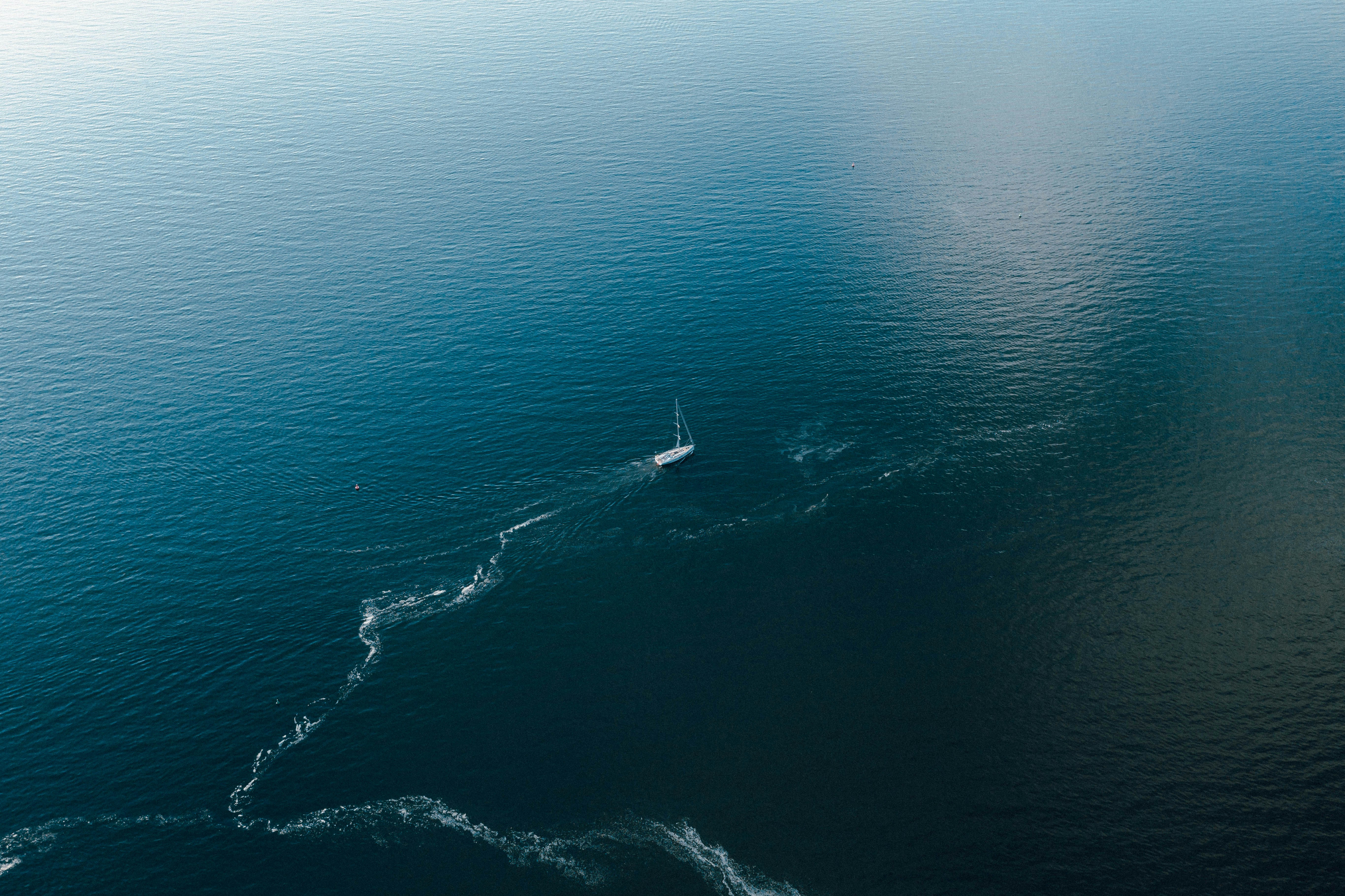 Aerial view of body of water during daytime photo – Free Wales Image on ...