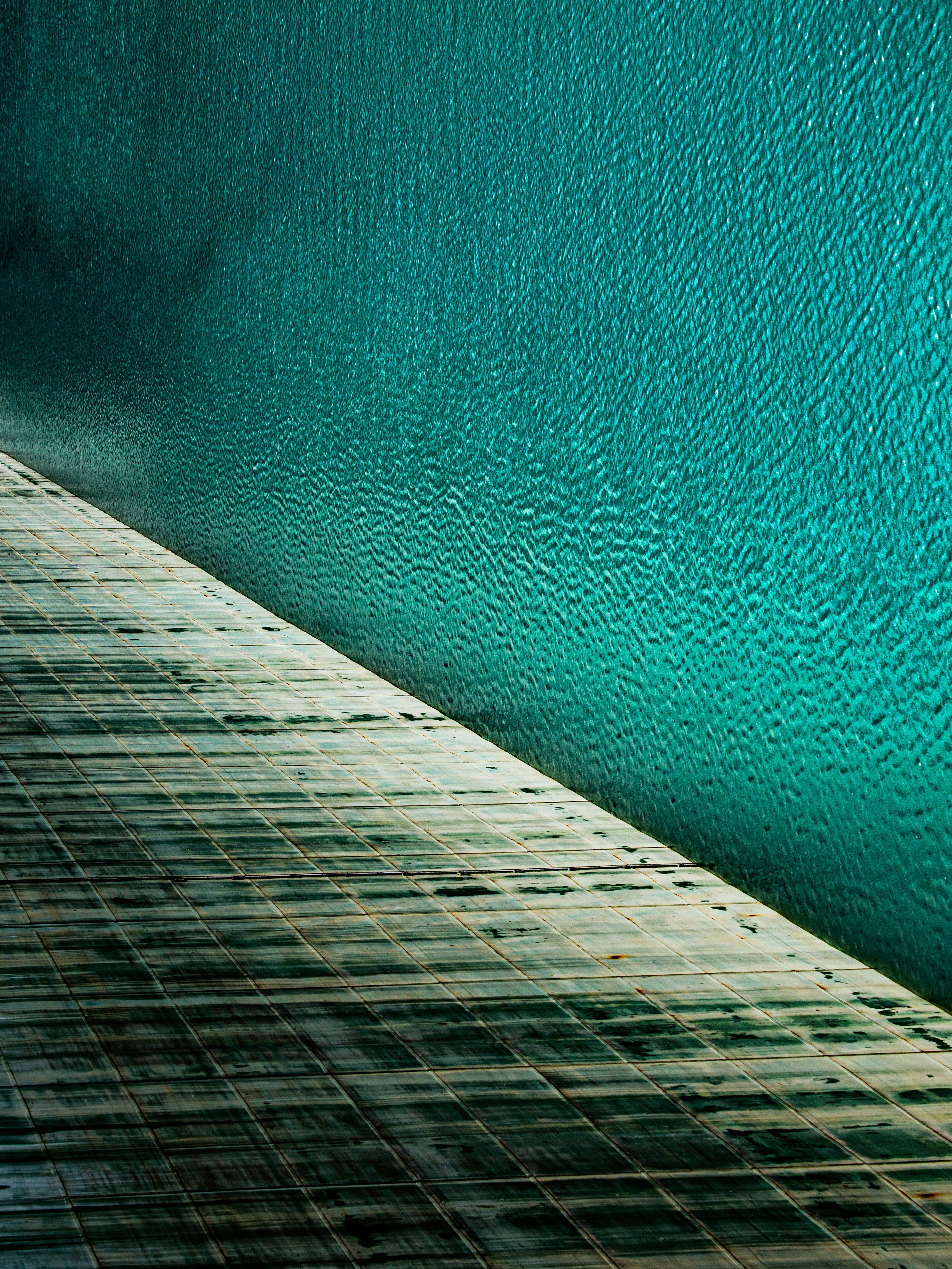 Diagonal Shore: A Tilt into Teal Glass and Skyward Lines