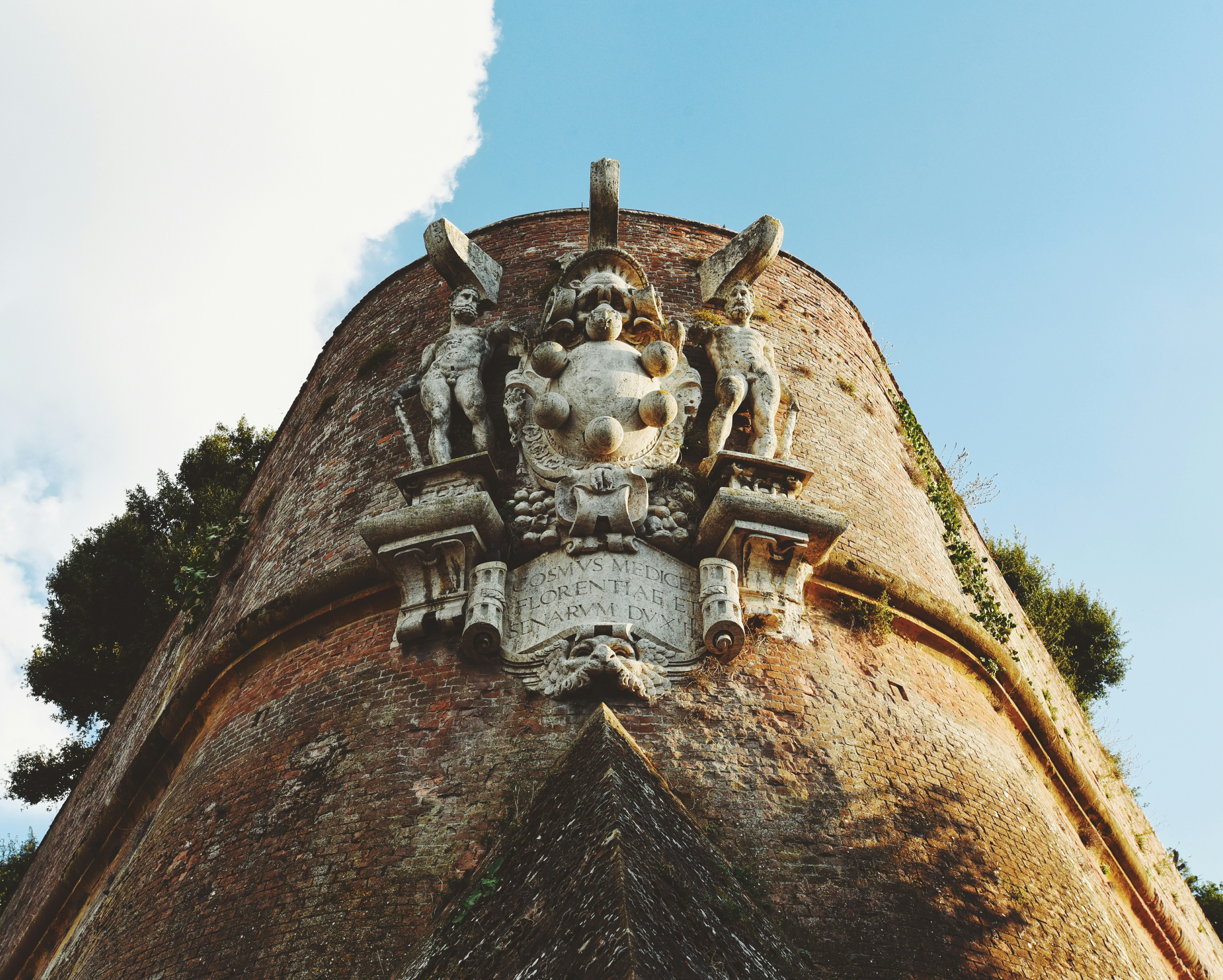 Stonecrest Crest: Carved Emblem Aloft on a Weathered Turret