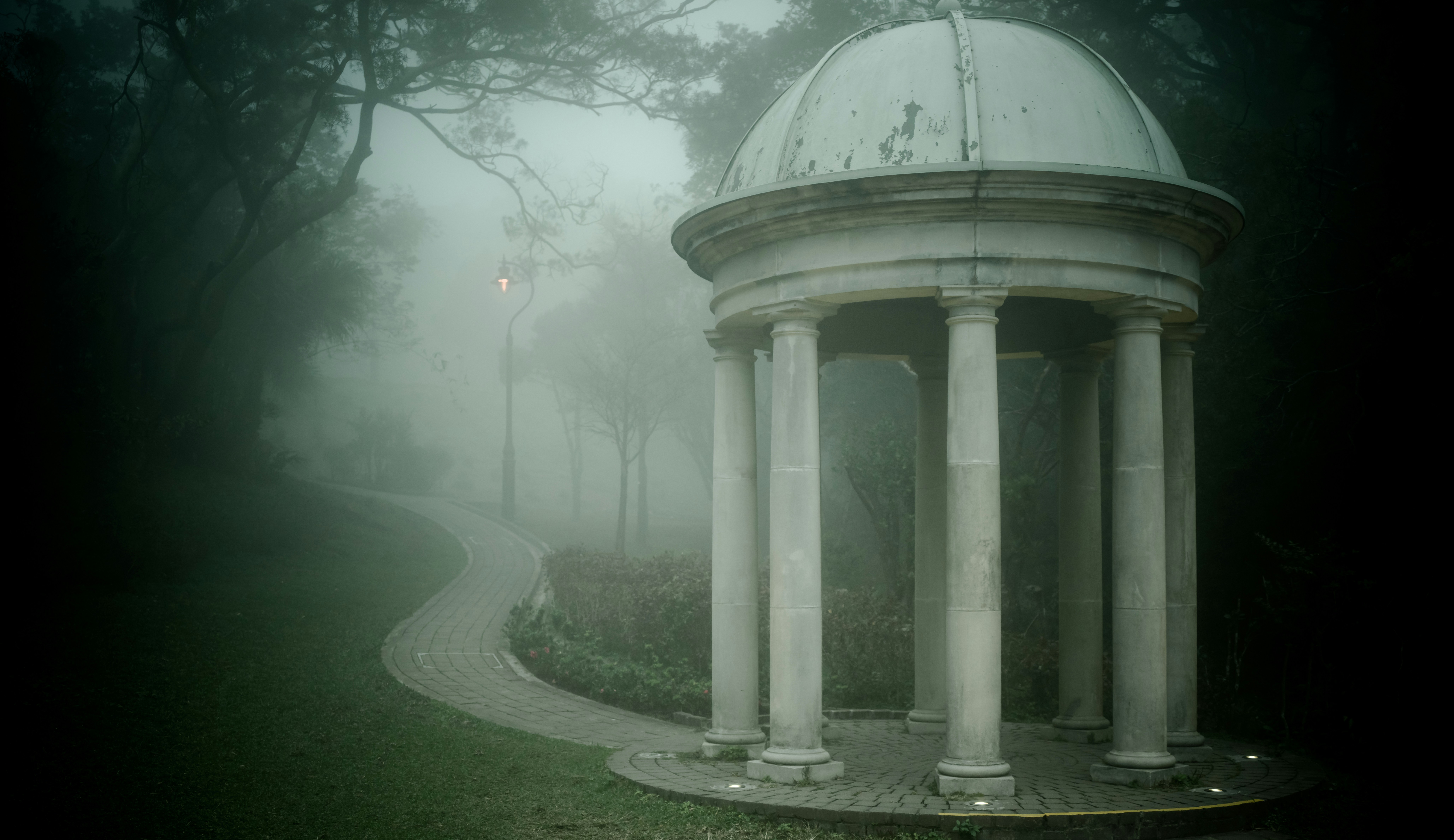 White concrete building near green grass field during daytime photo ...