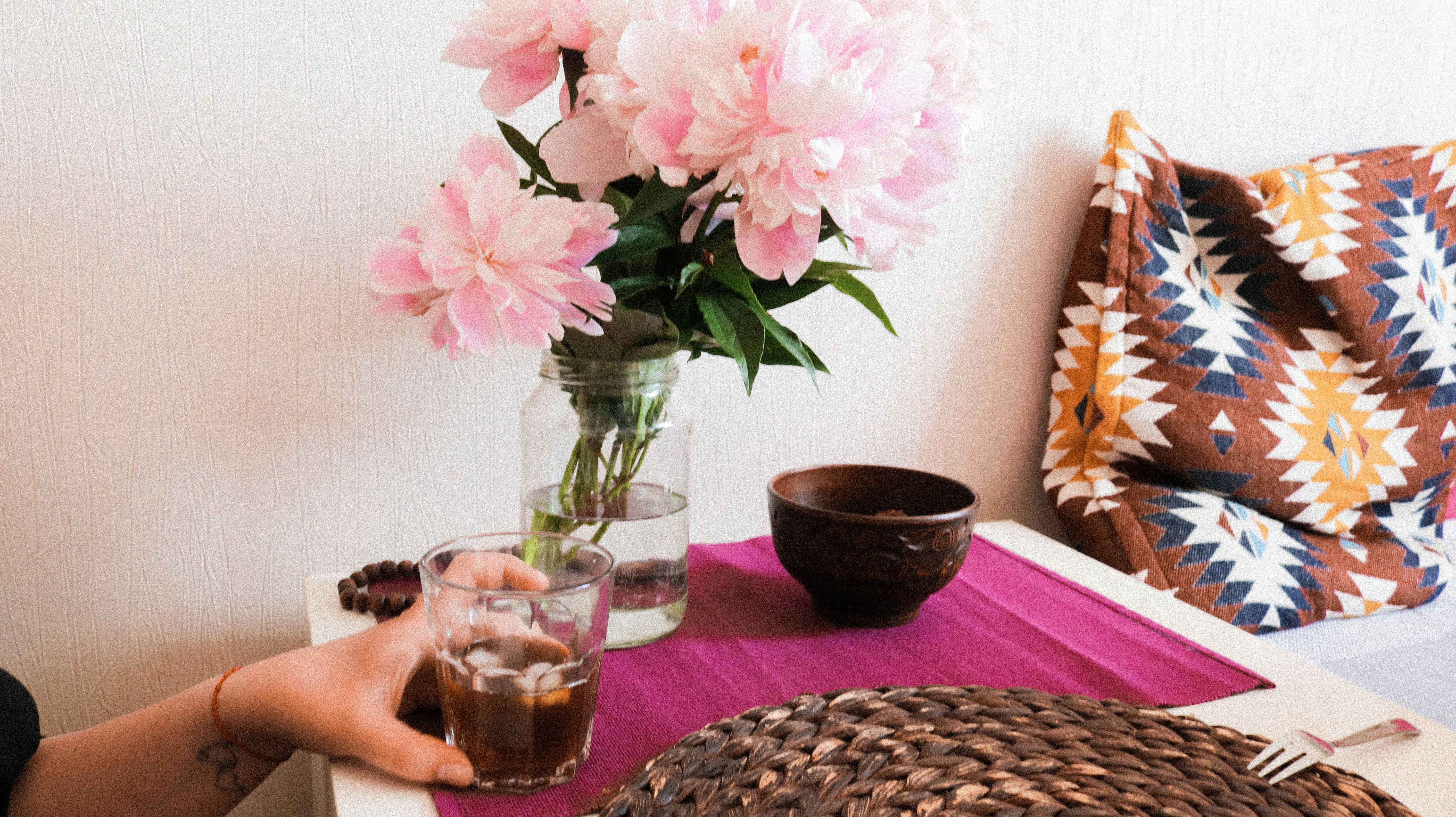 Petals, Glass, and Quiet Color on a Sunlit Table