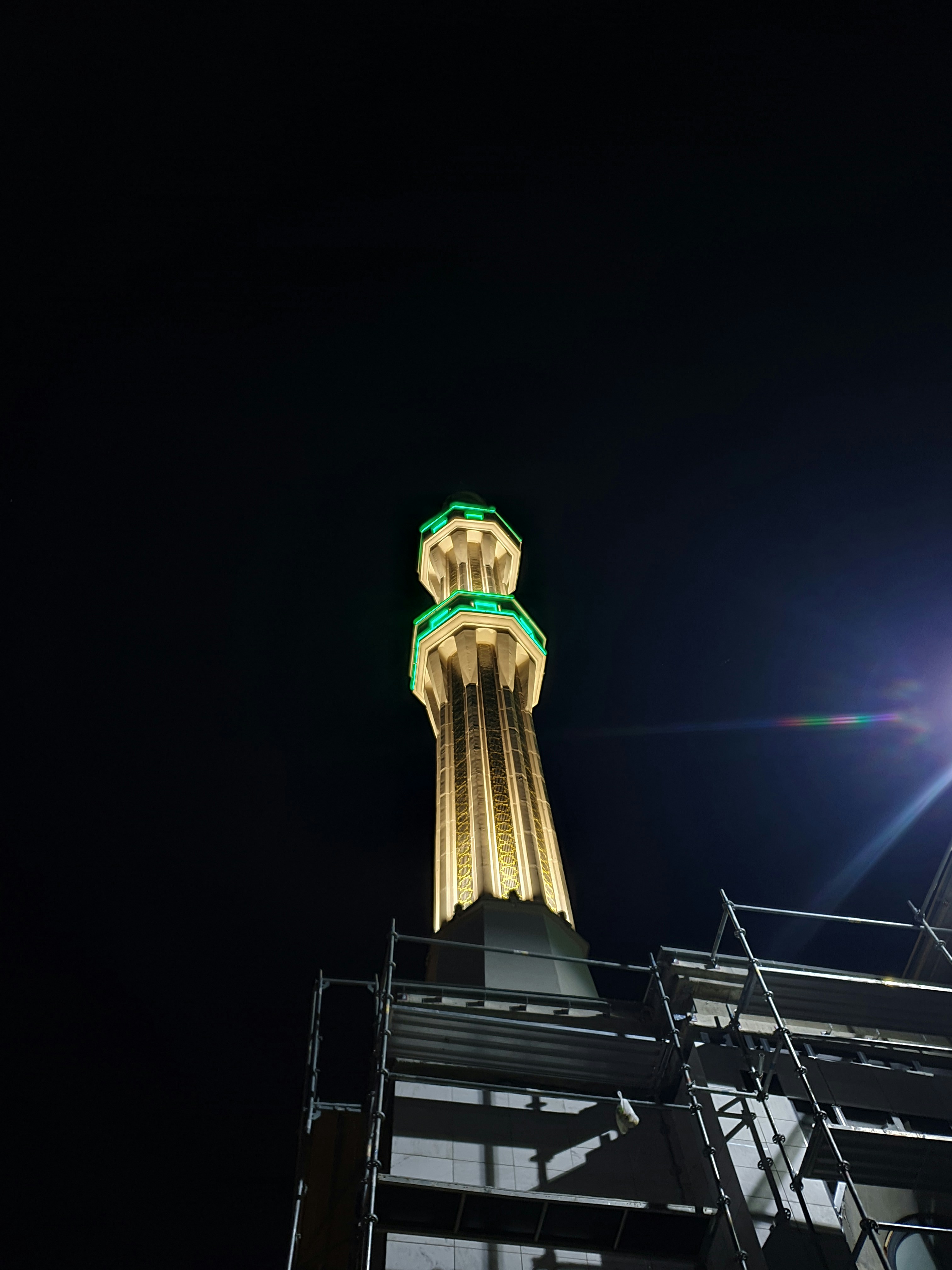 Illuminated Tower Against the Night Sky