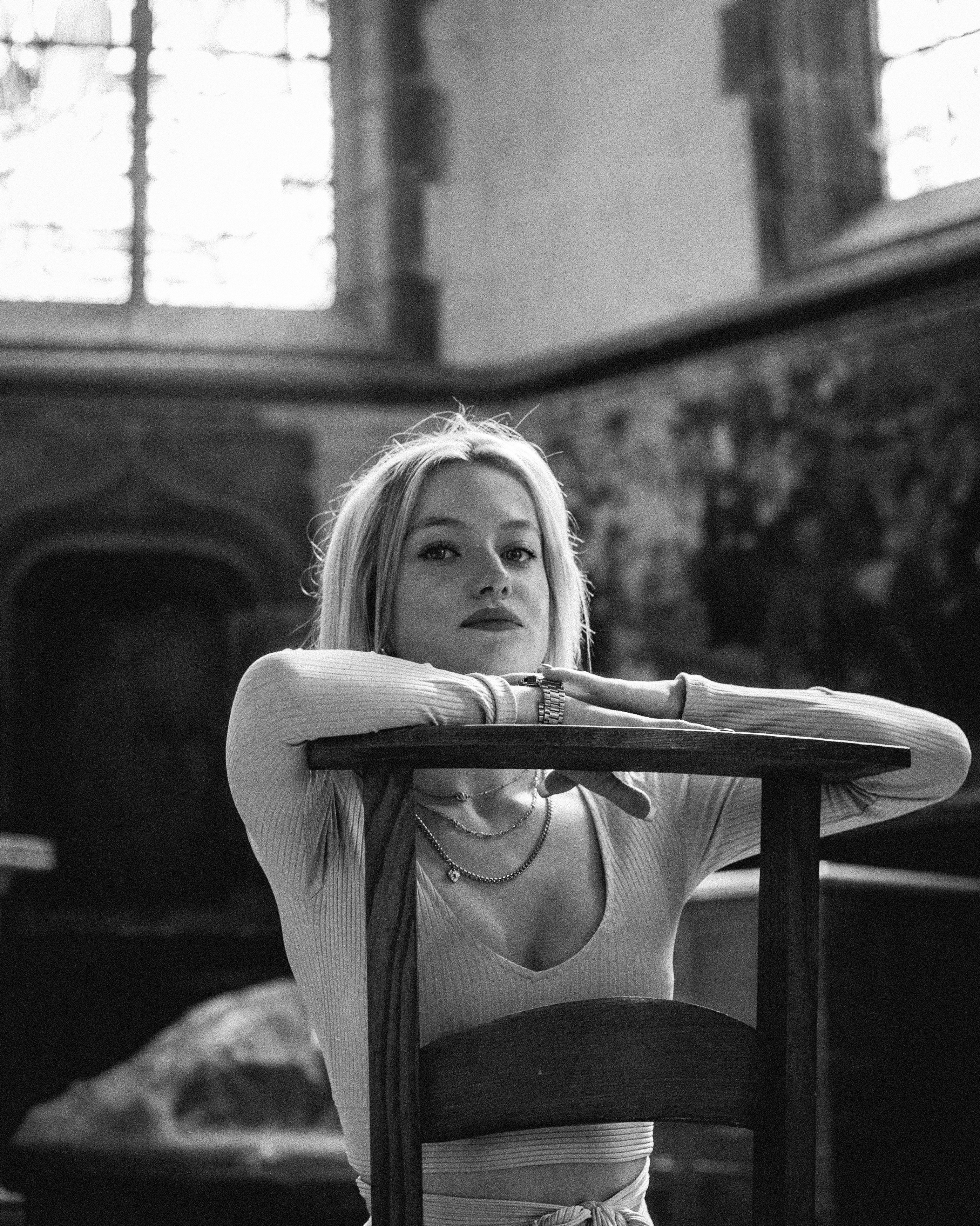 Stillness Under Cathedral Light: A Quiet Portrait in Black and White