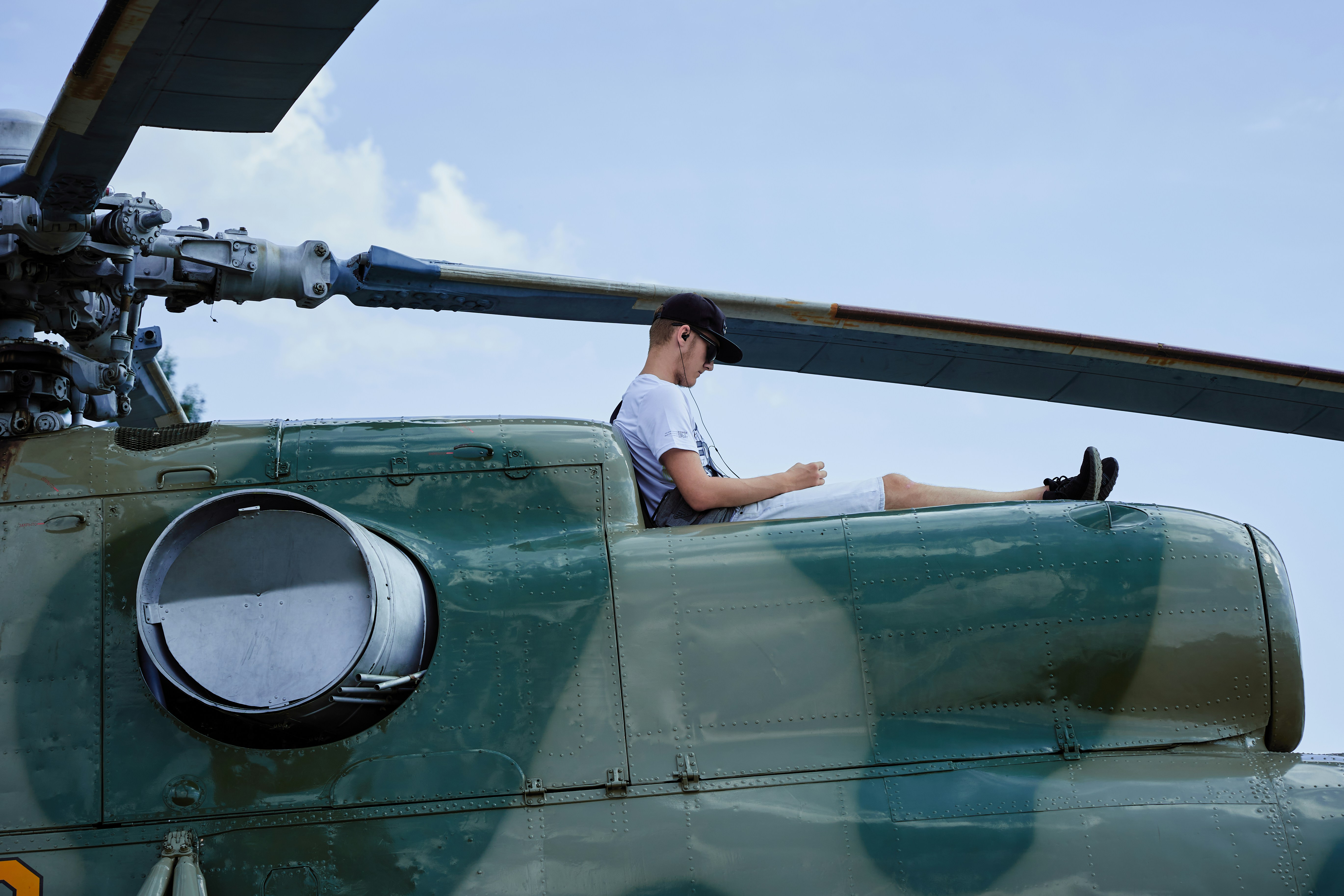 Rooftop Silent Observer: Man on a Cargo Wing
