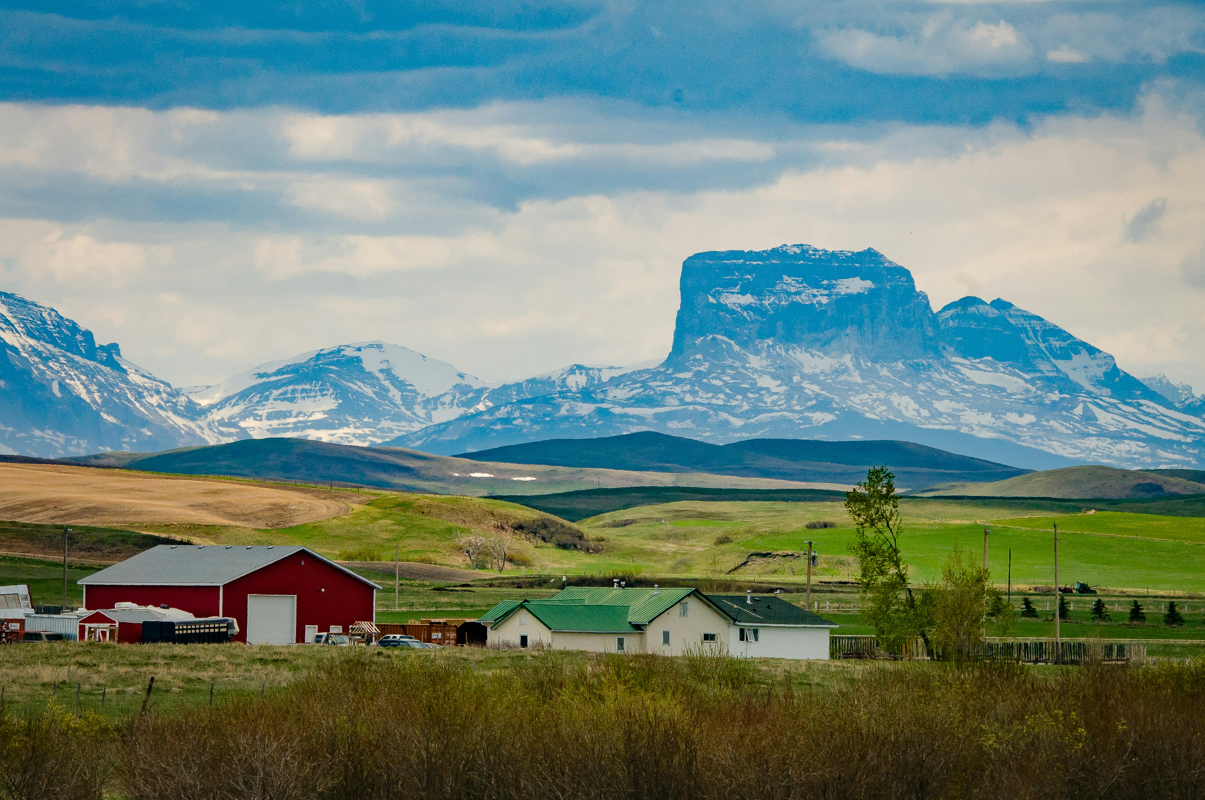 Snowcapped Mesa under a Wide Prairie Sky