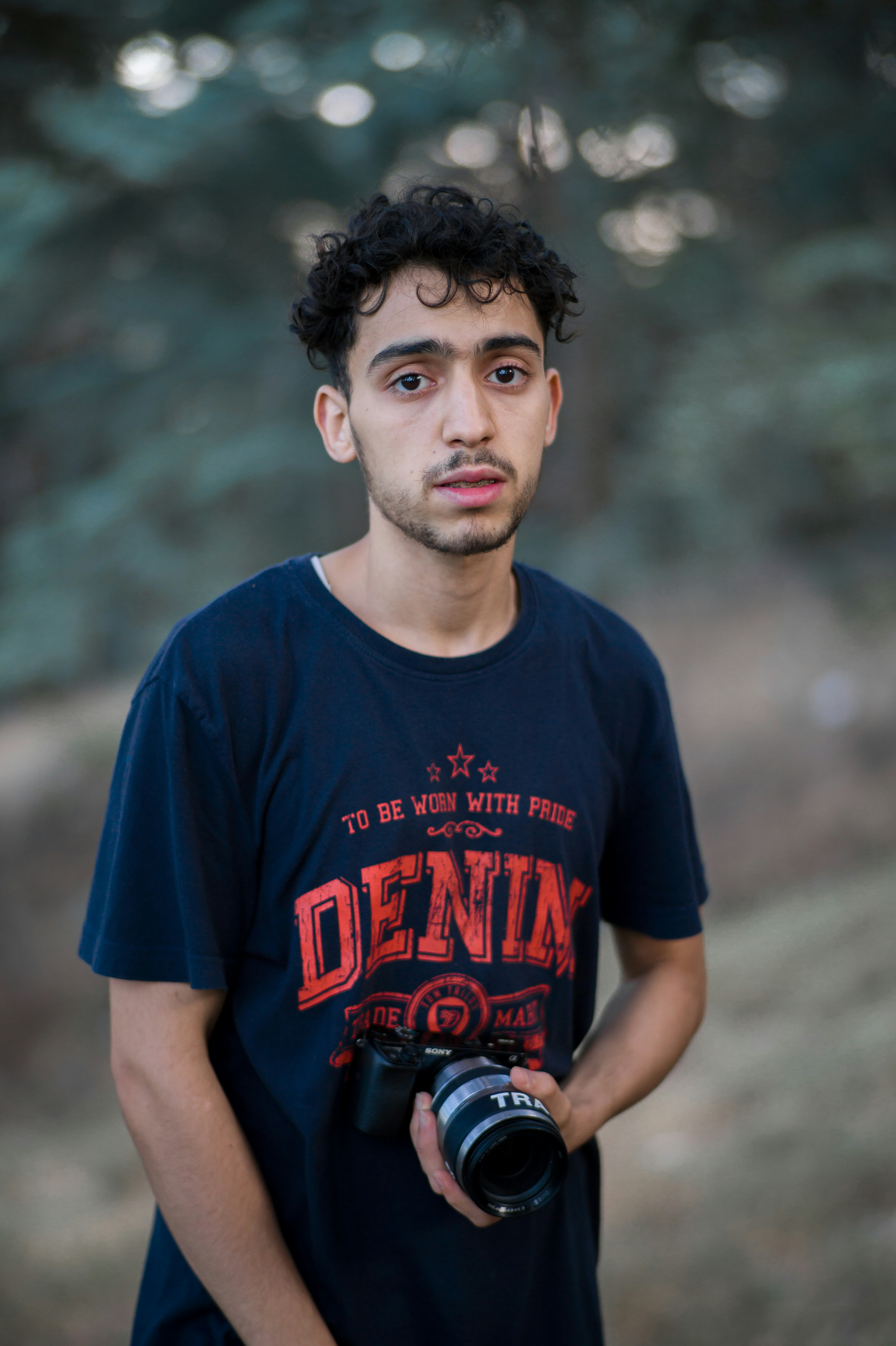 Portrait in Soft Focus: Youthful Gamer with Camera in Hand