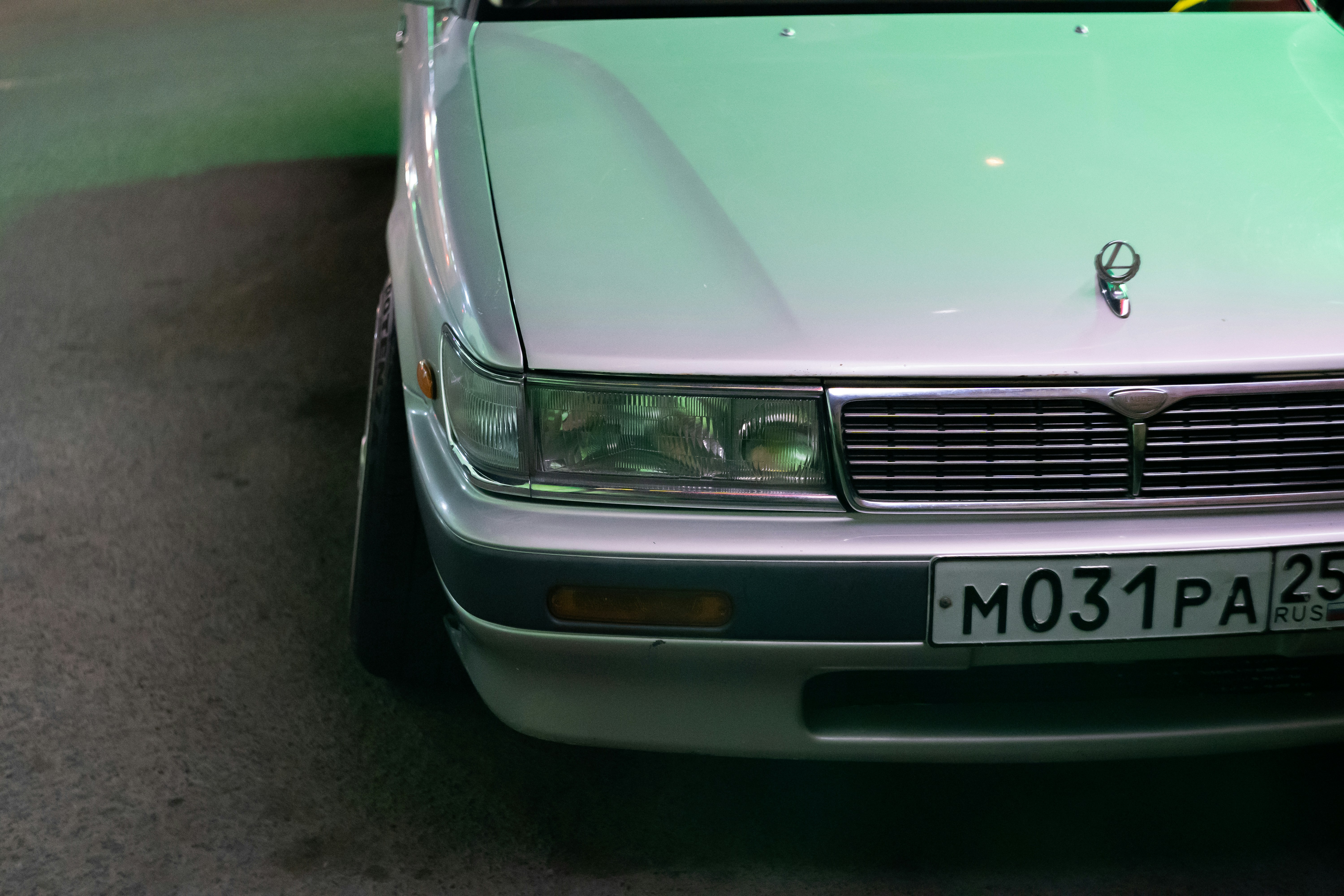 Vintage Elegance: Nissan Laurel in Urban Glow