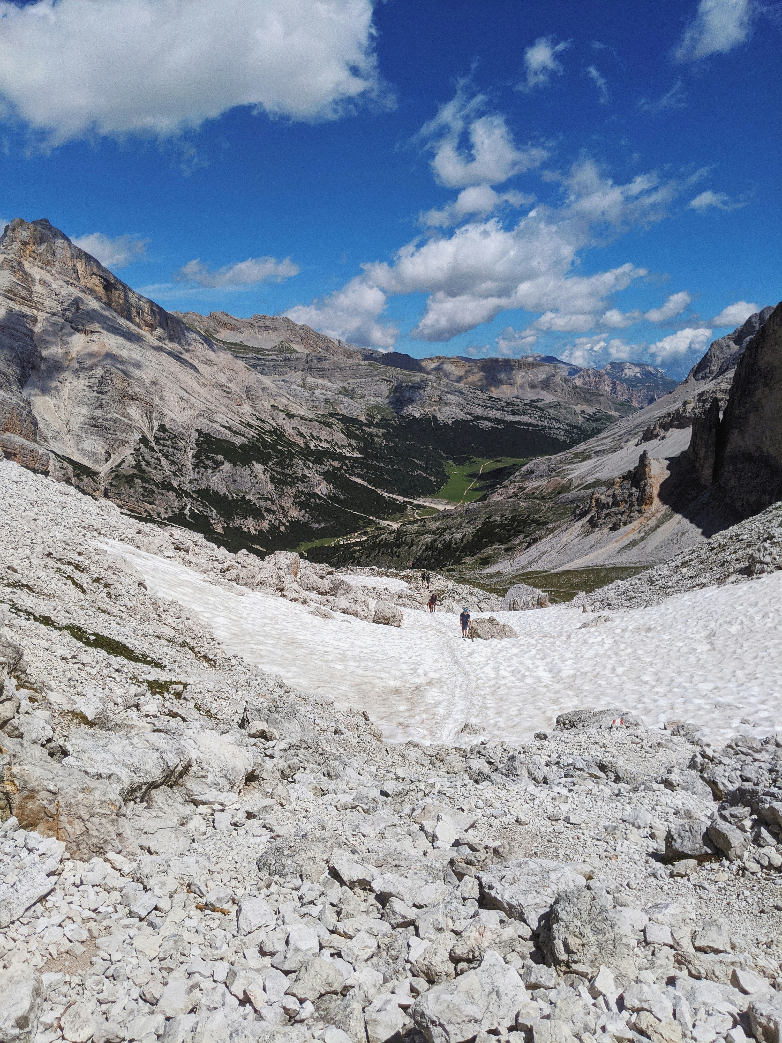 Alpine Snowfield Ascent Beneath Jagged Peaks