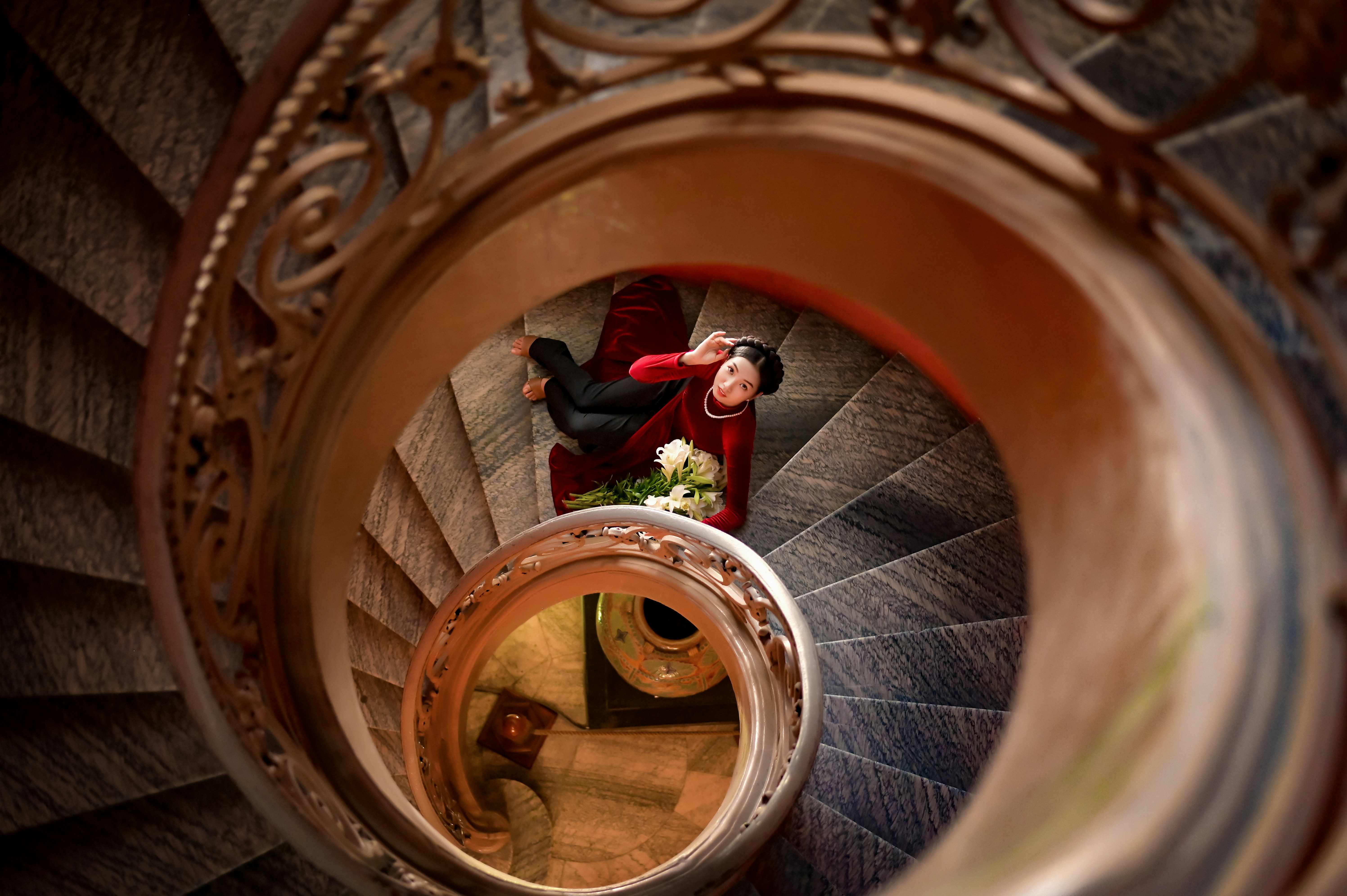 Red on the Spiral: A Portrait on a Circular Staircase