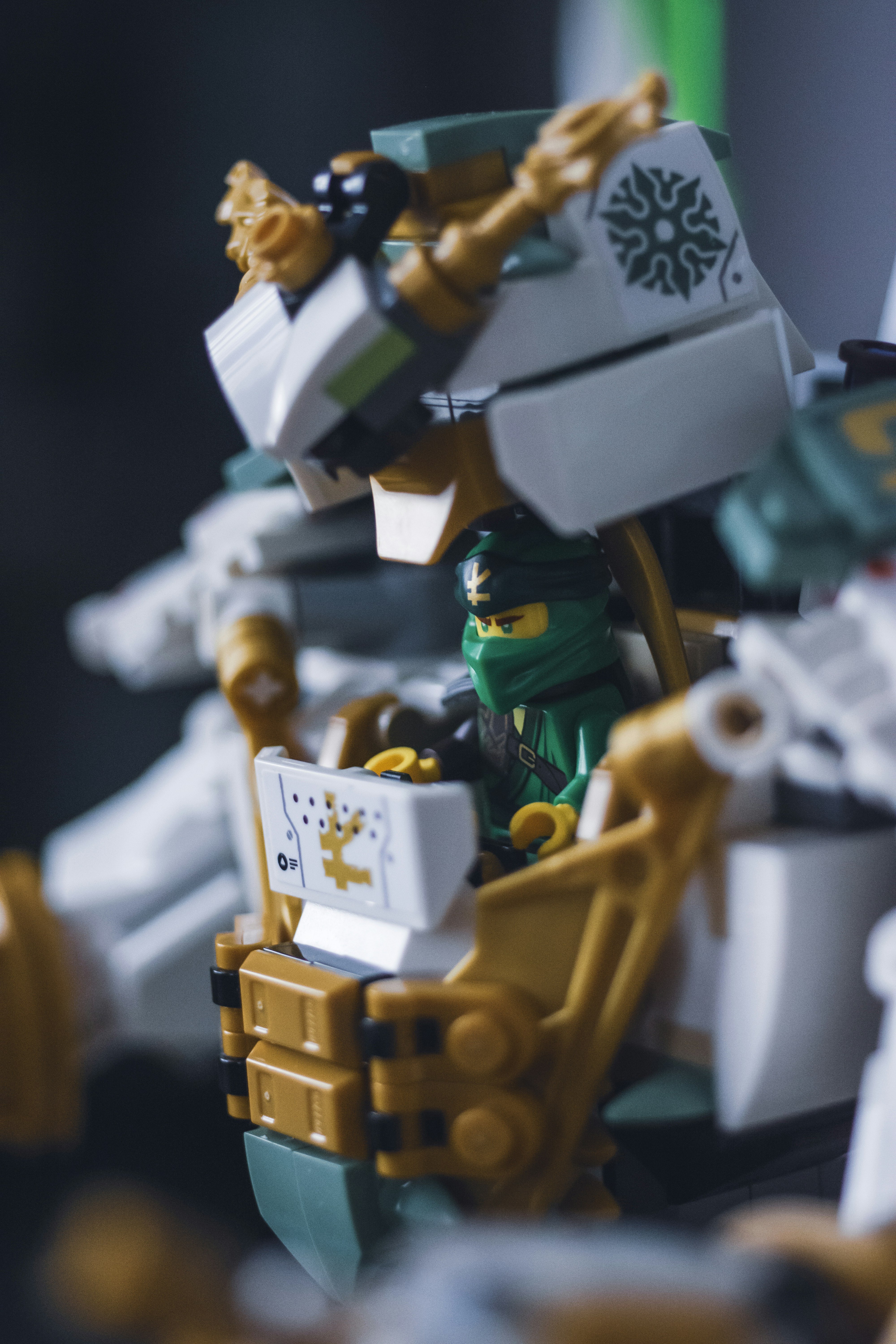 A detailed close-up of a ninja figure inside a mechanized armor, showcasing intricate design and vibrant colors.