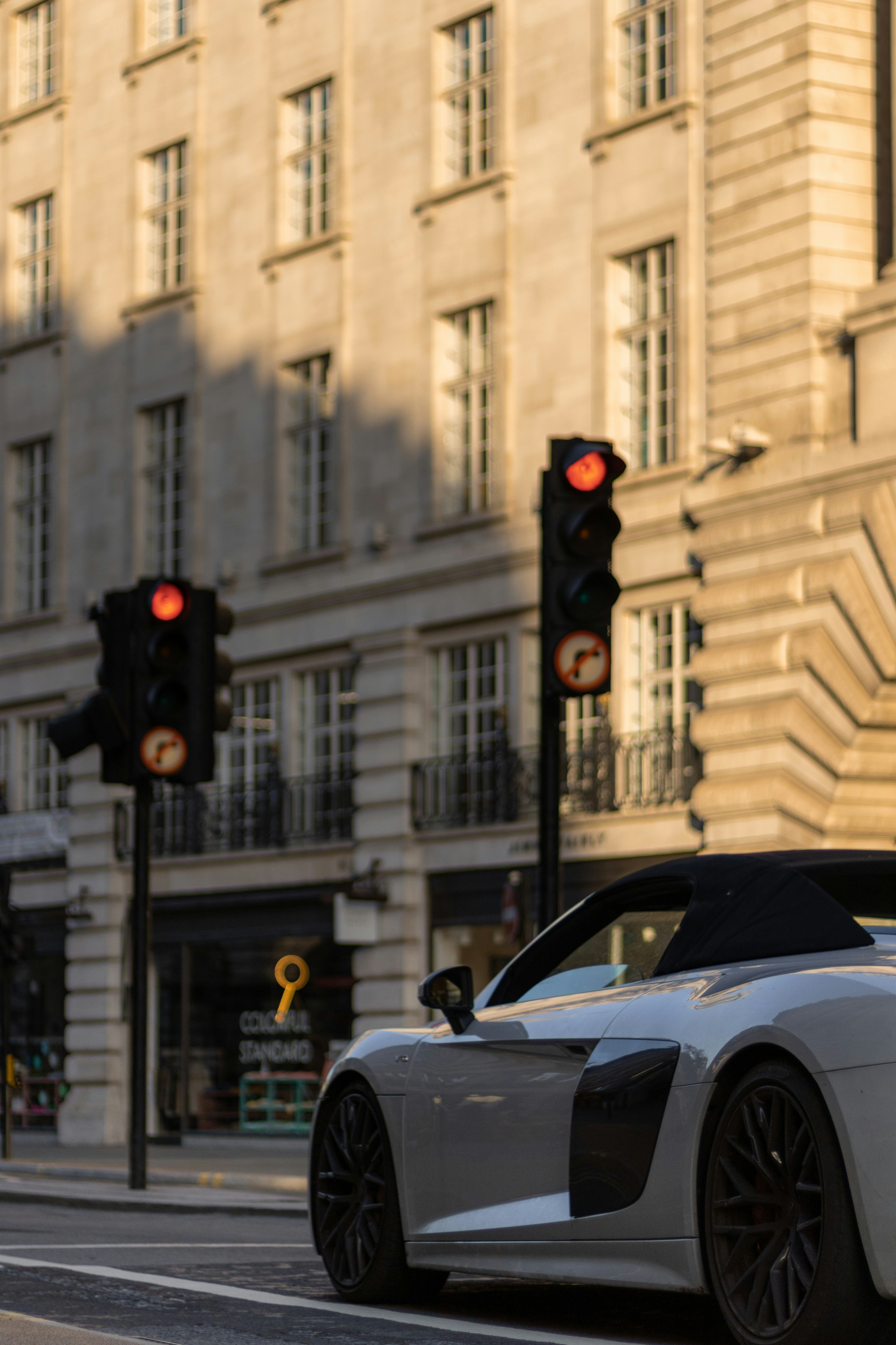 Amber Hour Rendezvous: A White Supercar at a City Crossroads
