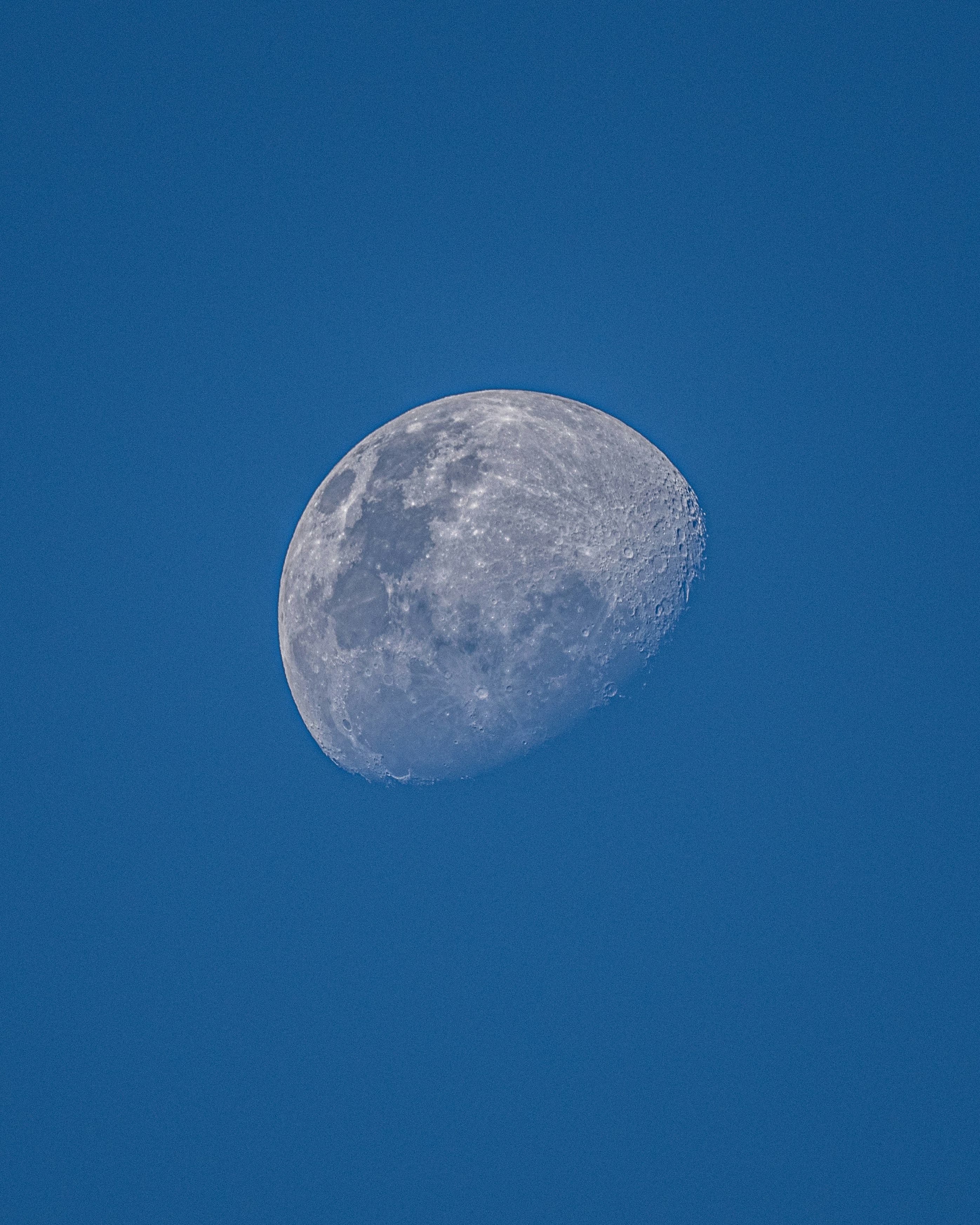 full moon in blue sky