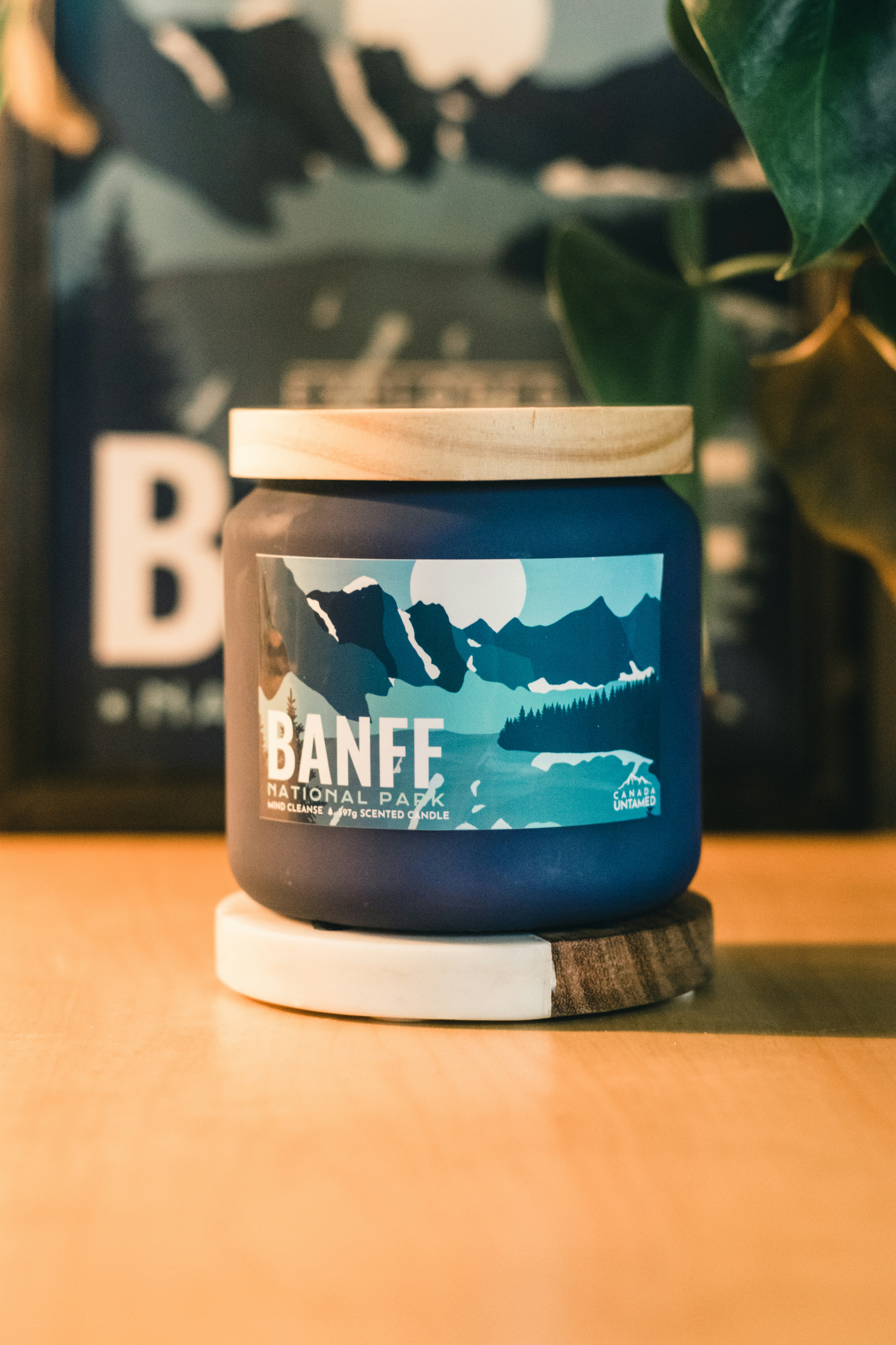 Blue Canyon Candle Jar in Focus: Center Stage on a Wooden Coaster
