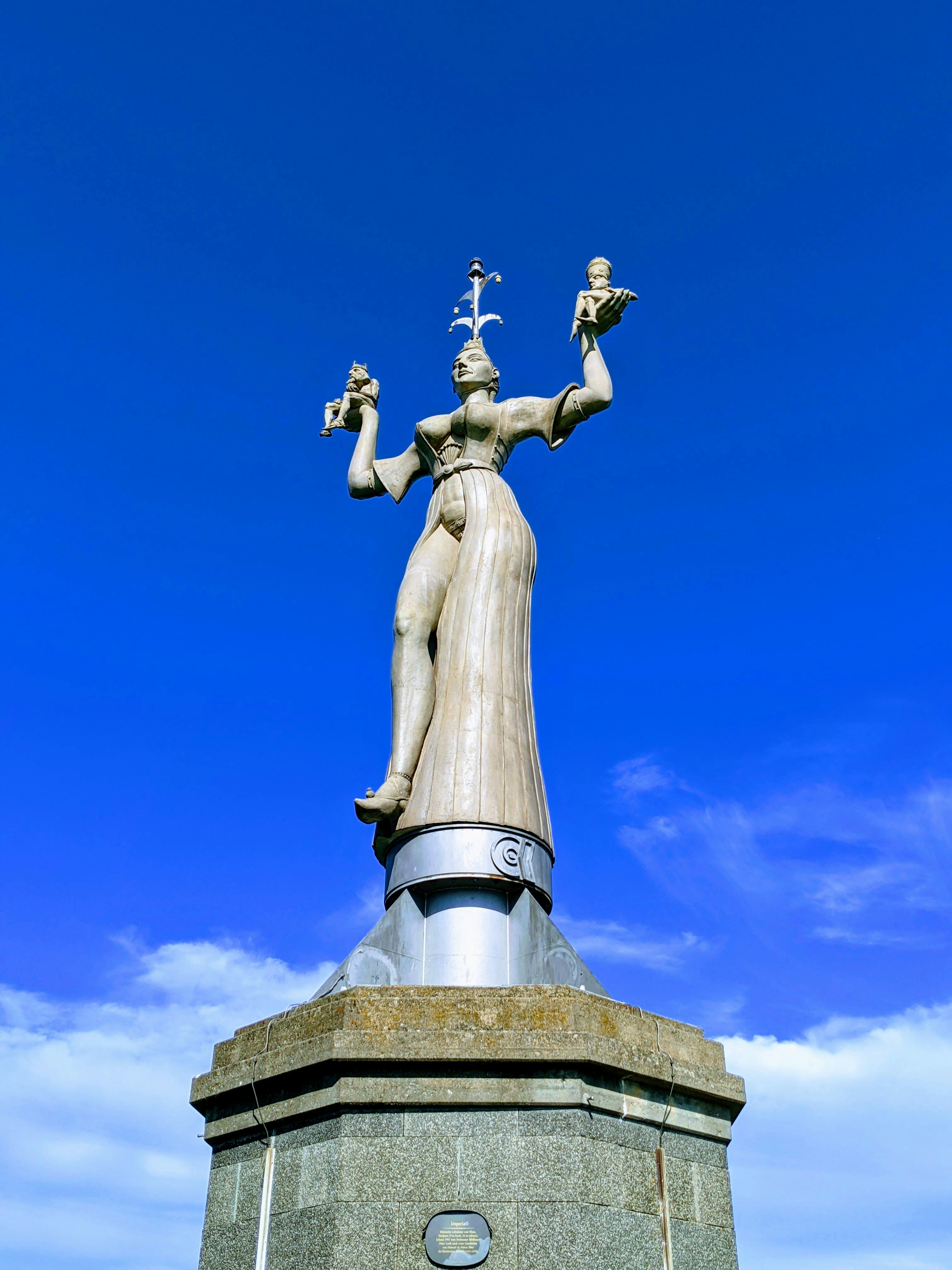 Imperia statue. | gold statue of a man