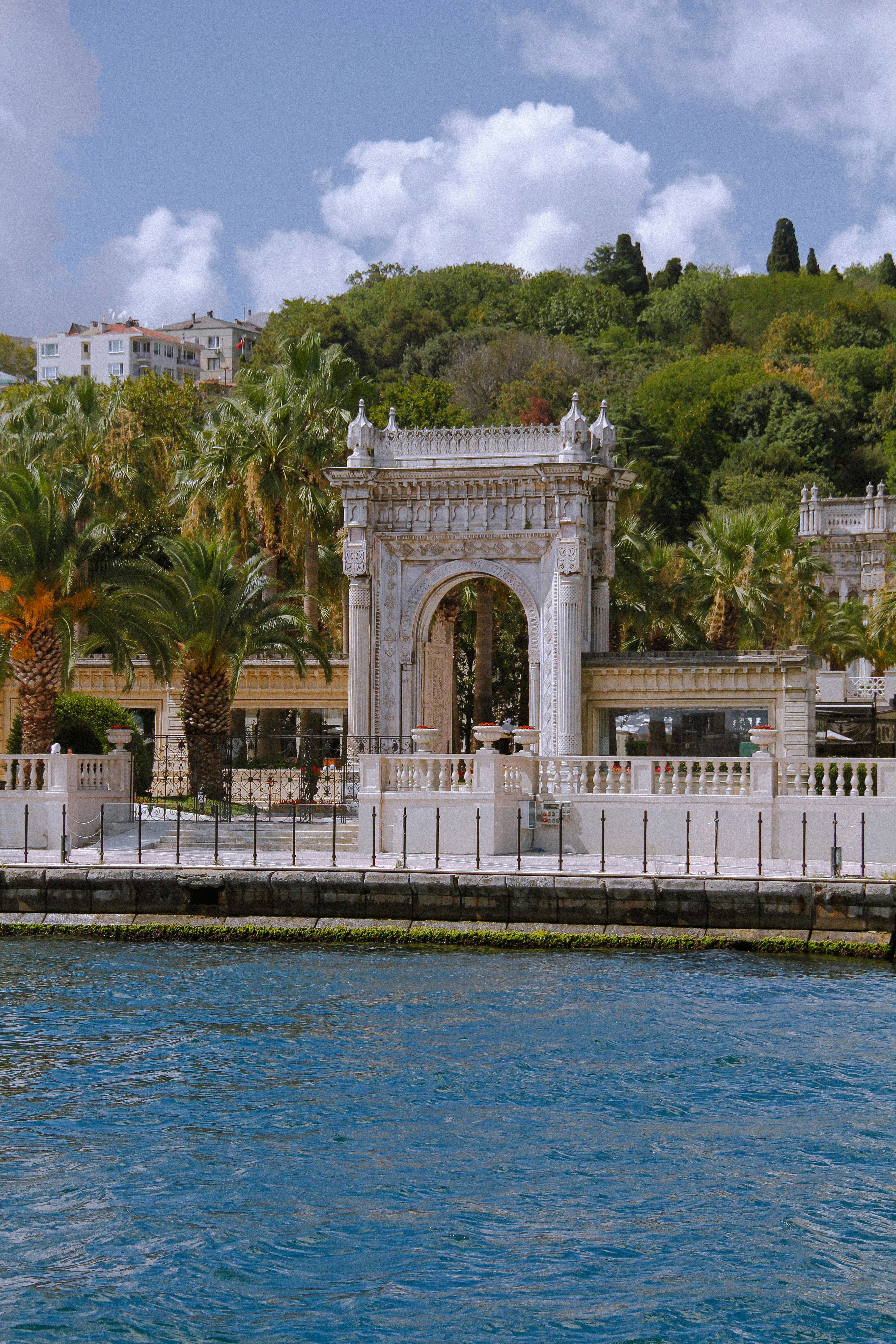 Marble Arch by the Sea: Palm-Lined Waterfront Gateway