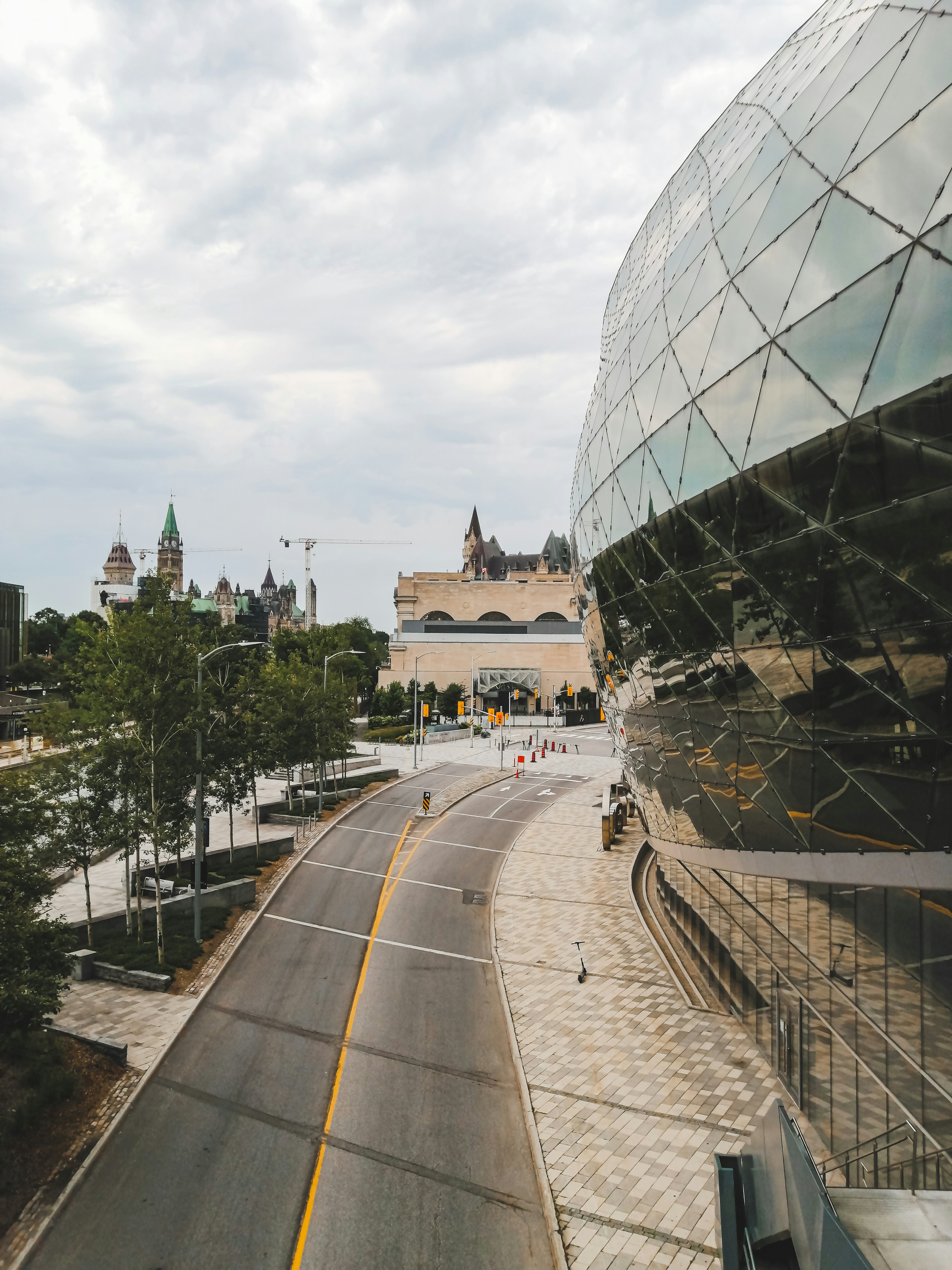 Gray concrete building near road during daytime photo – Free Canada ...