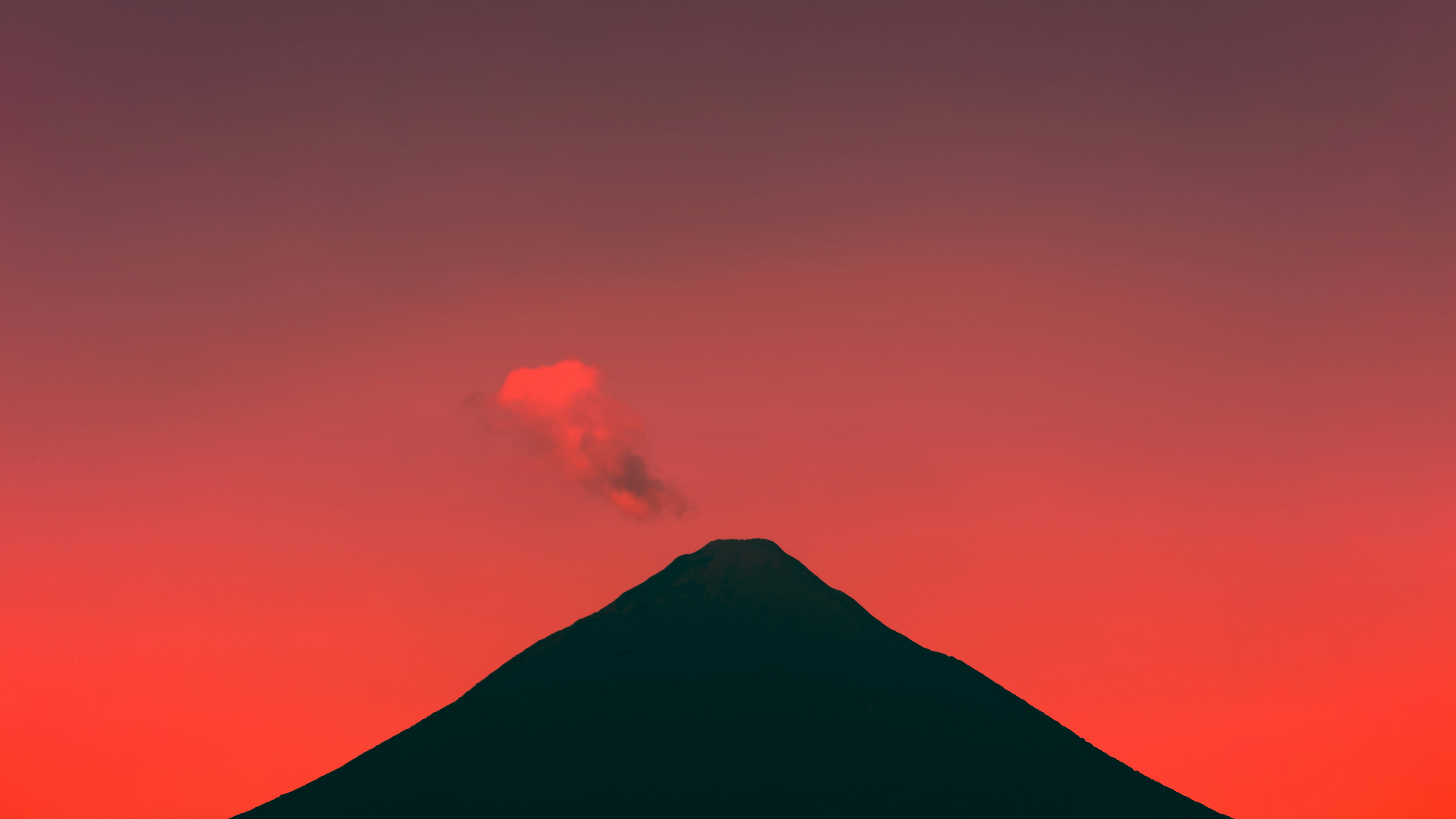 Crimson Horizon Over a Slumbering Volcano with a Gentle Smoke Plume