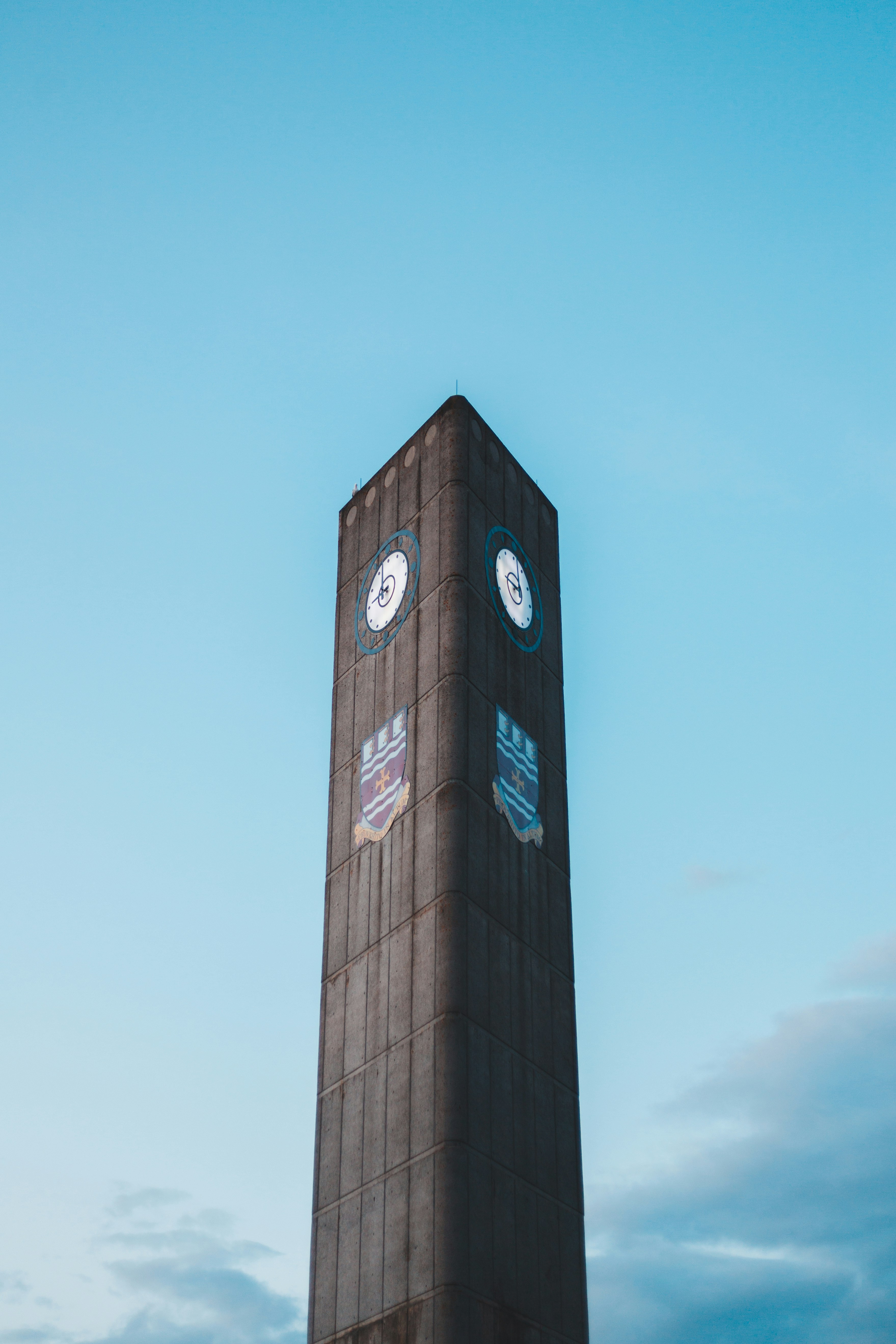 Clock Tower Rising: Weathered Beacon Against a Clear Sky