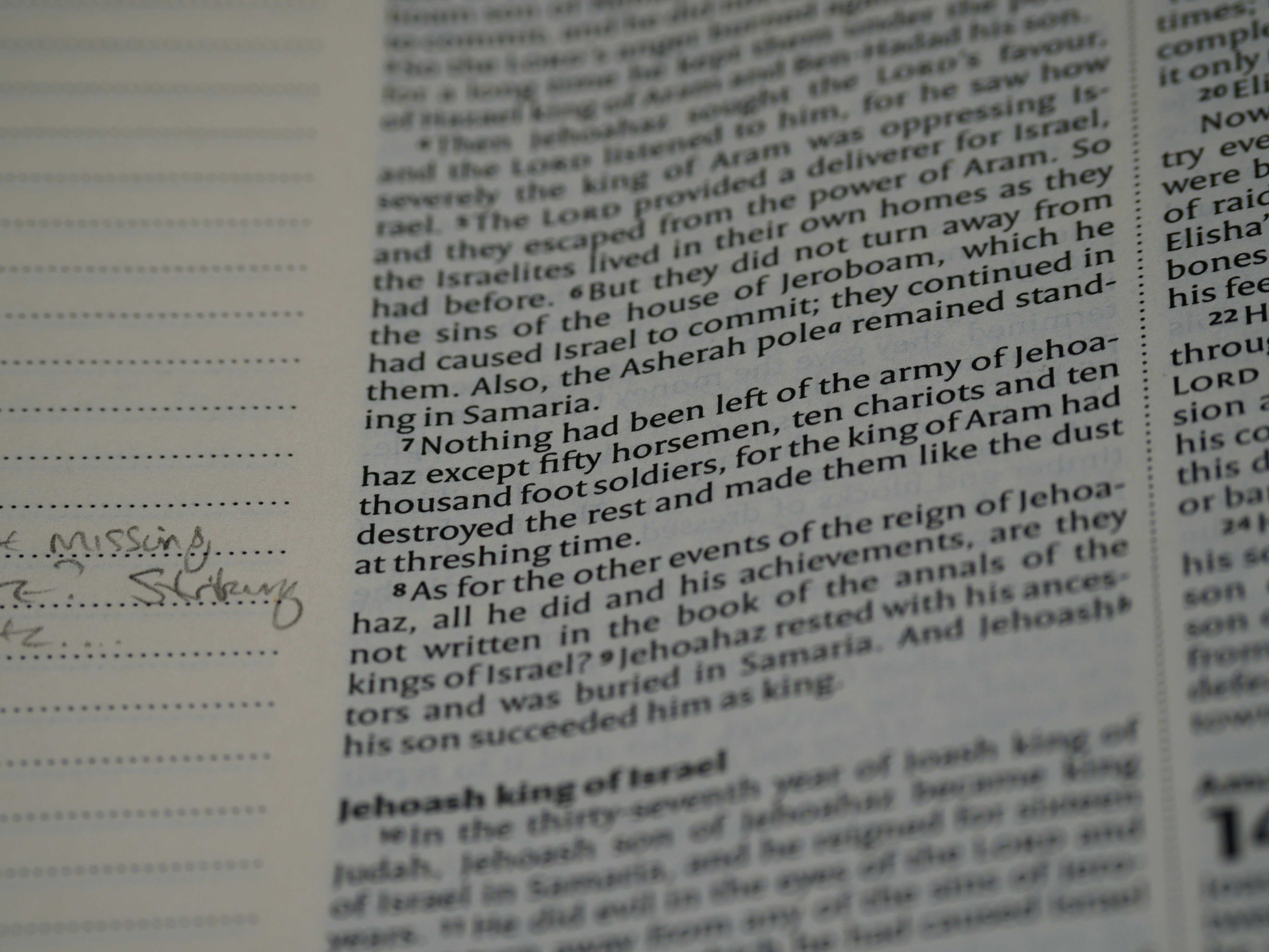 Open Bible page featuring historical accounts and annotations, highlighting the reign of Jehoahaz and his military endeavors.