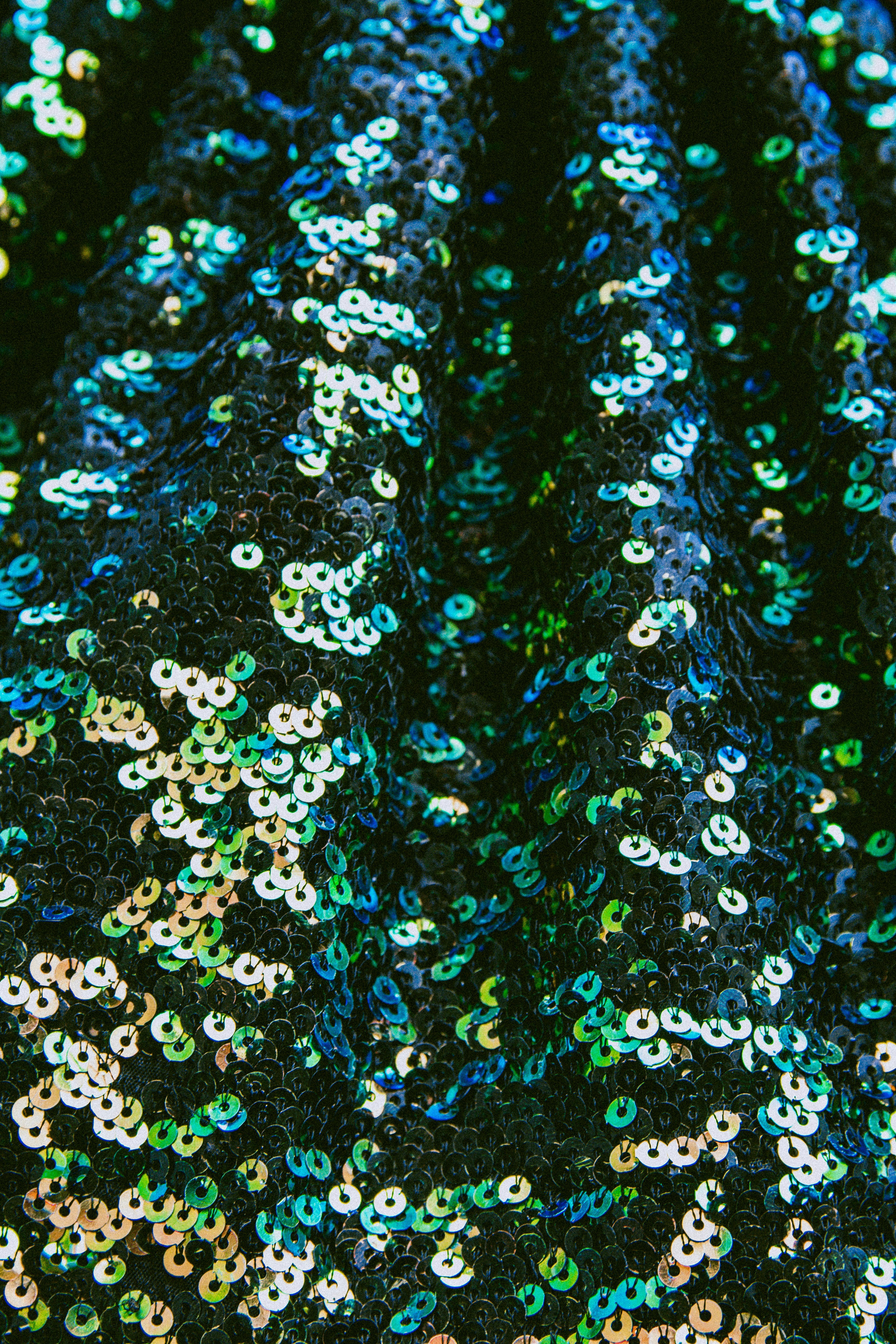 Emerald Velvet: Close-Up of Shimmering Sequin Fabric