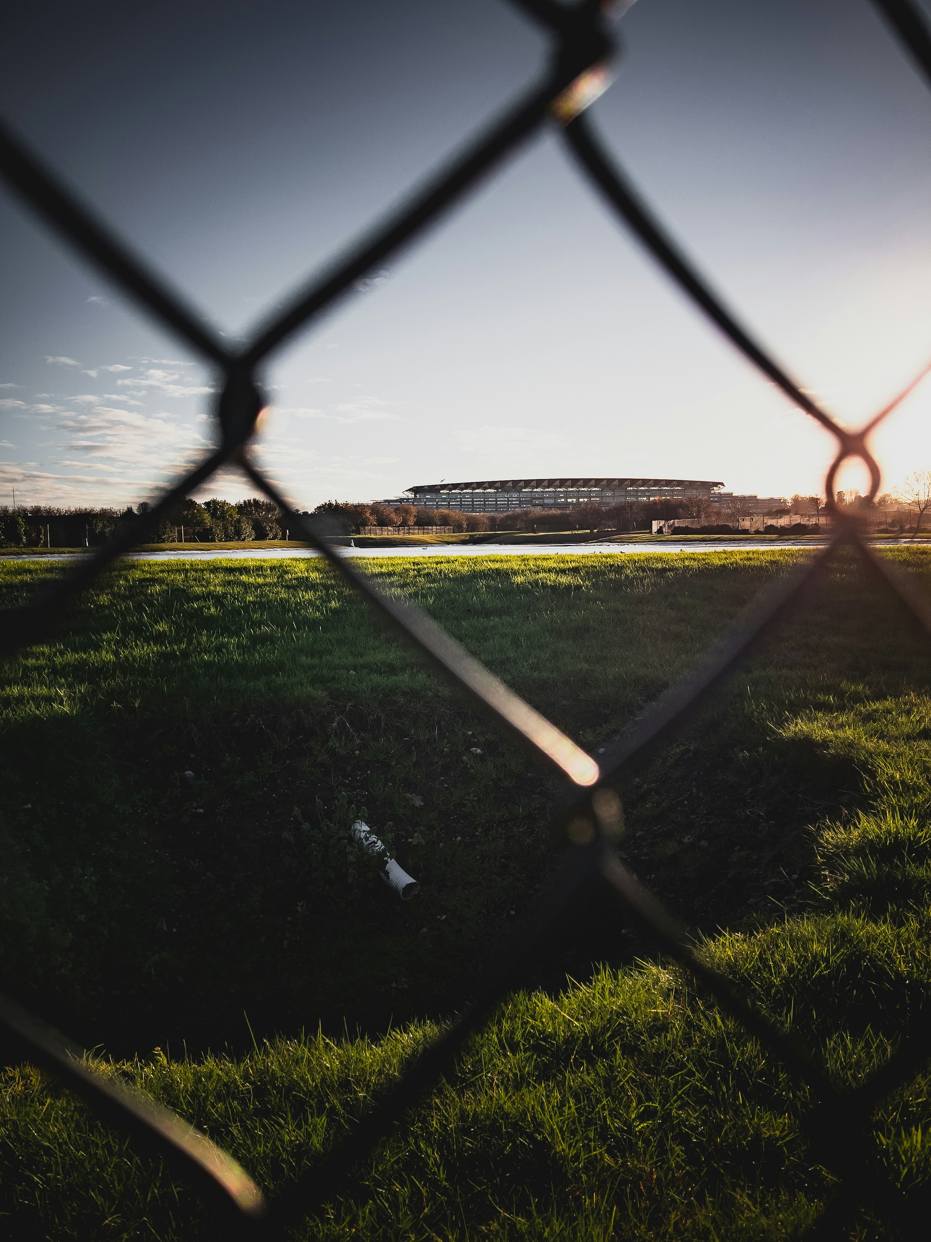 Gray metal fence on green grass field during daytime photo – Free ...