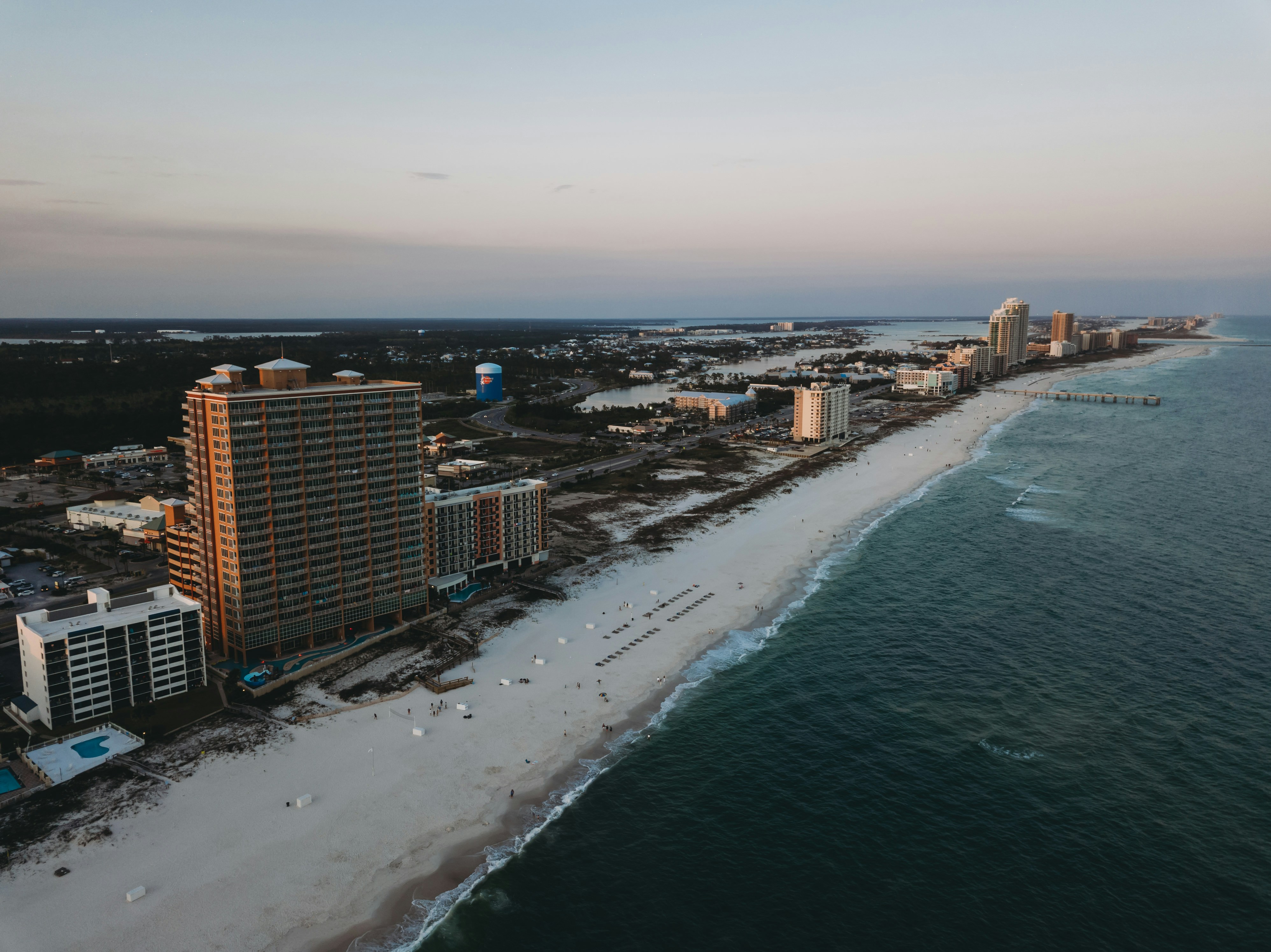High rise buildings near sea during daytime photo – Free Beach Image on ...