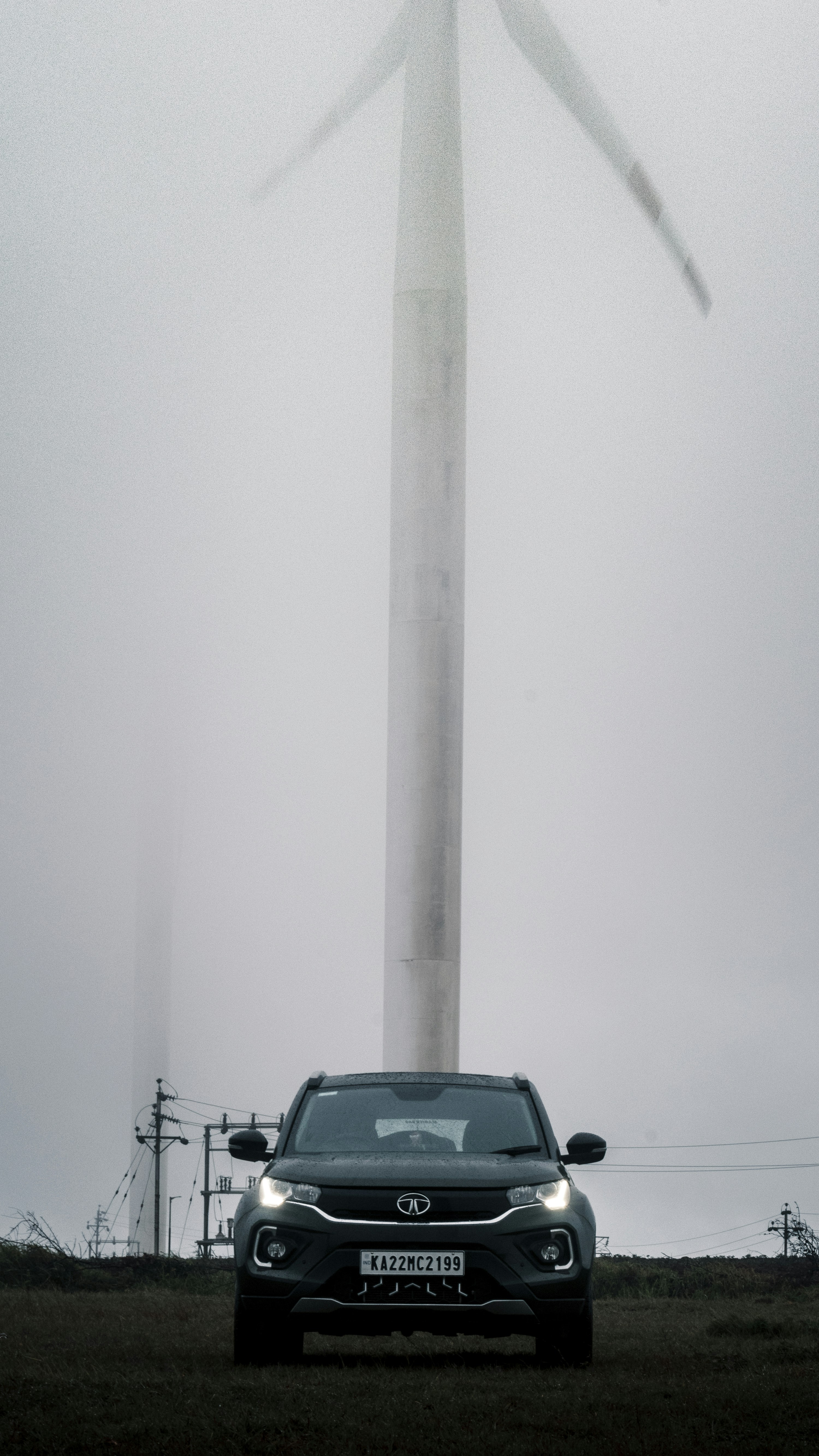 black car parked near white wall