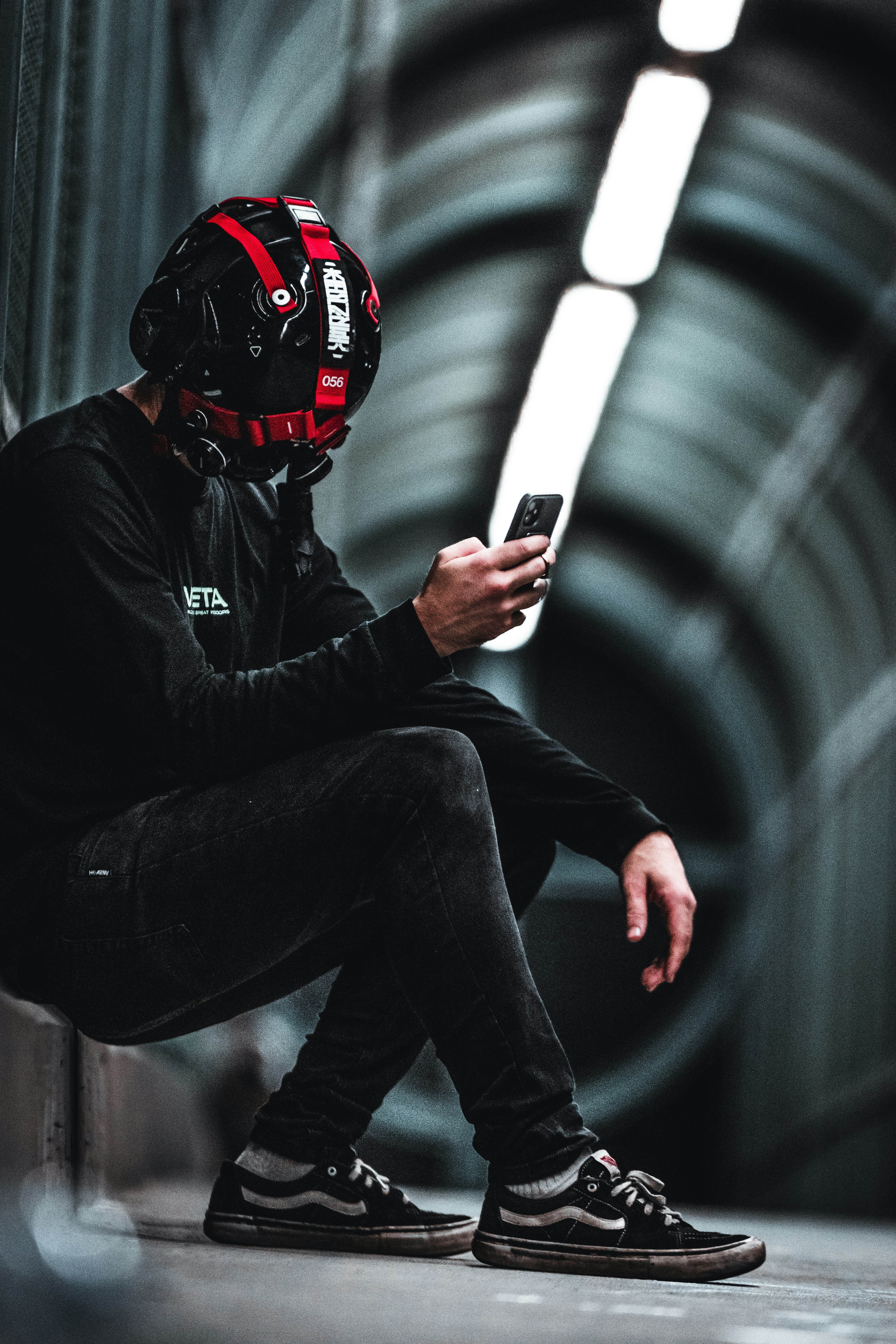 Man in black jacket and black pants holding white and red box mod photo ...