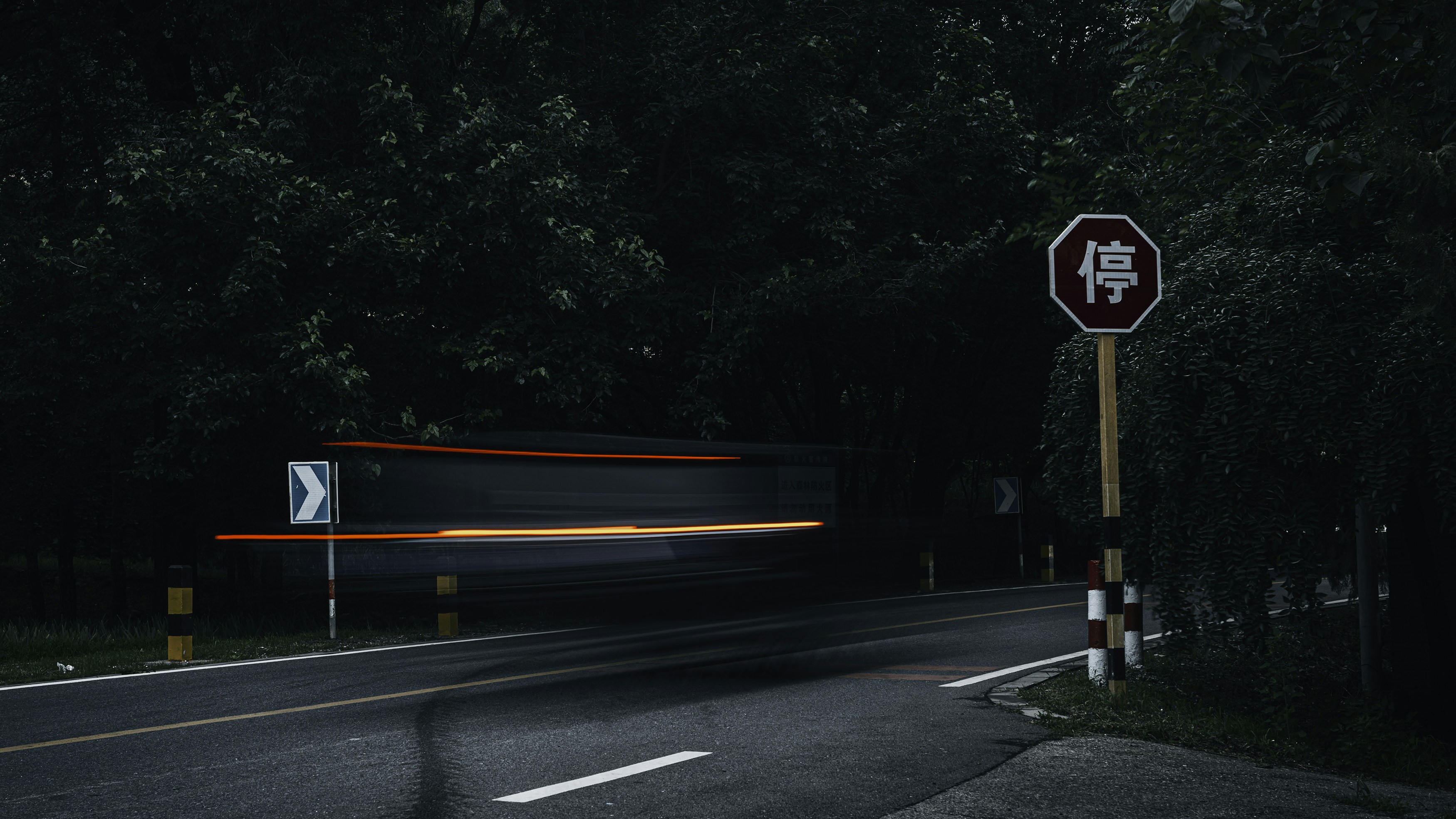 intersection | red and white stop sign on road