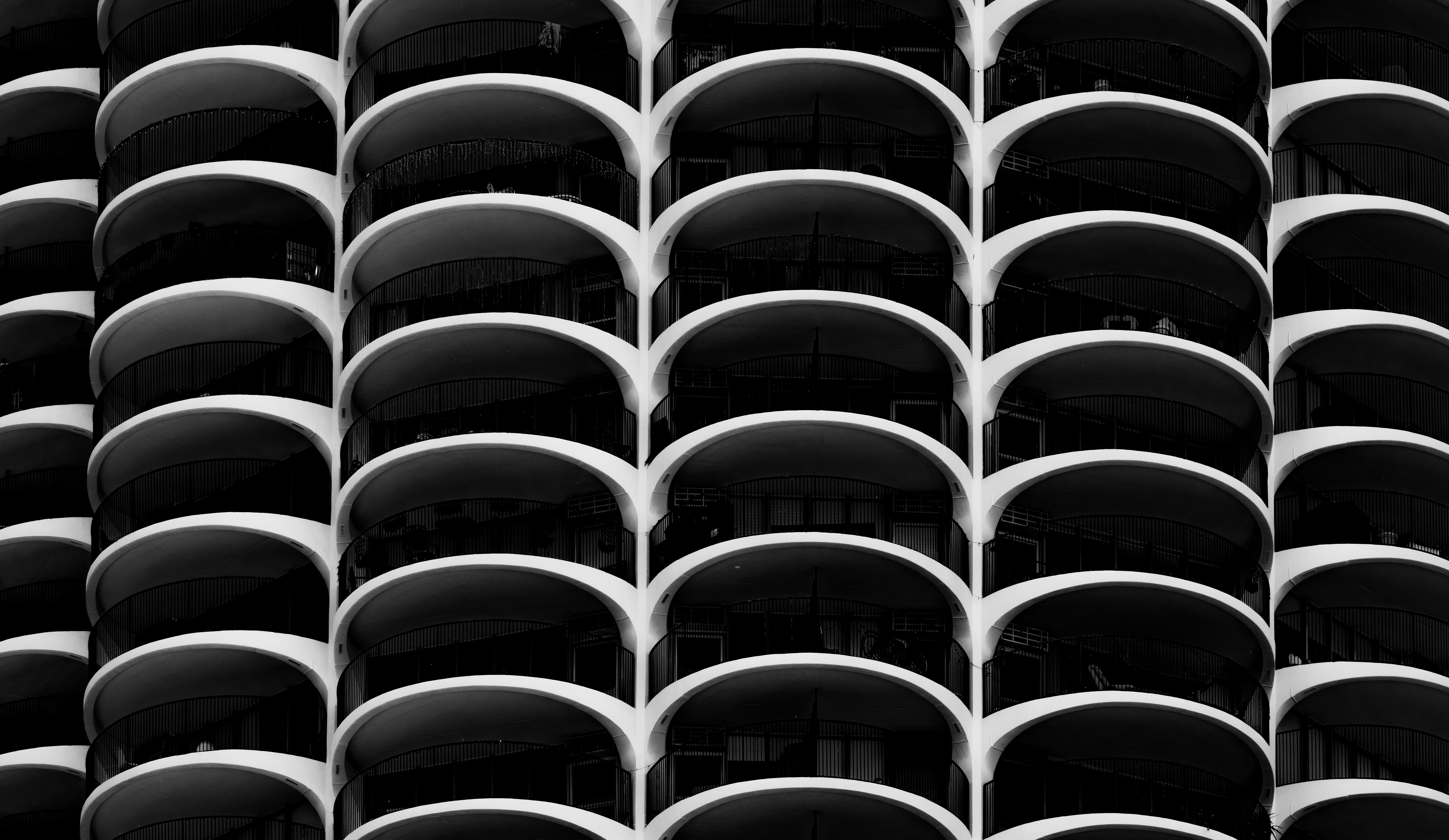 Monochrome Arches: A Cadence of Repeating Balconies