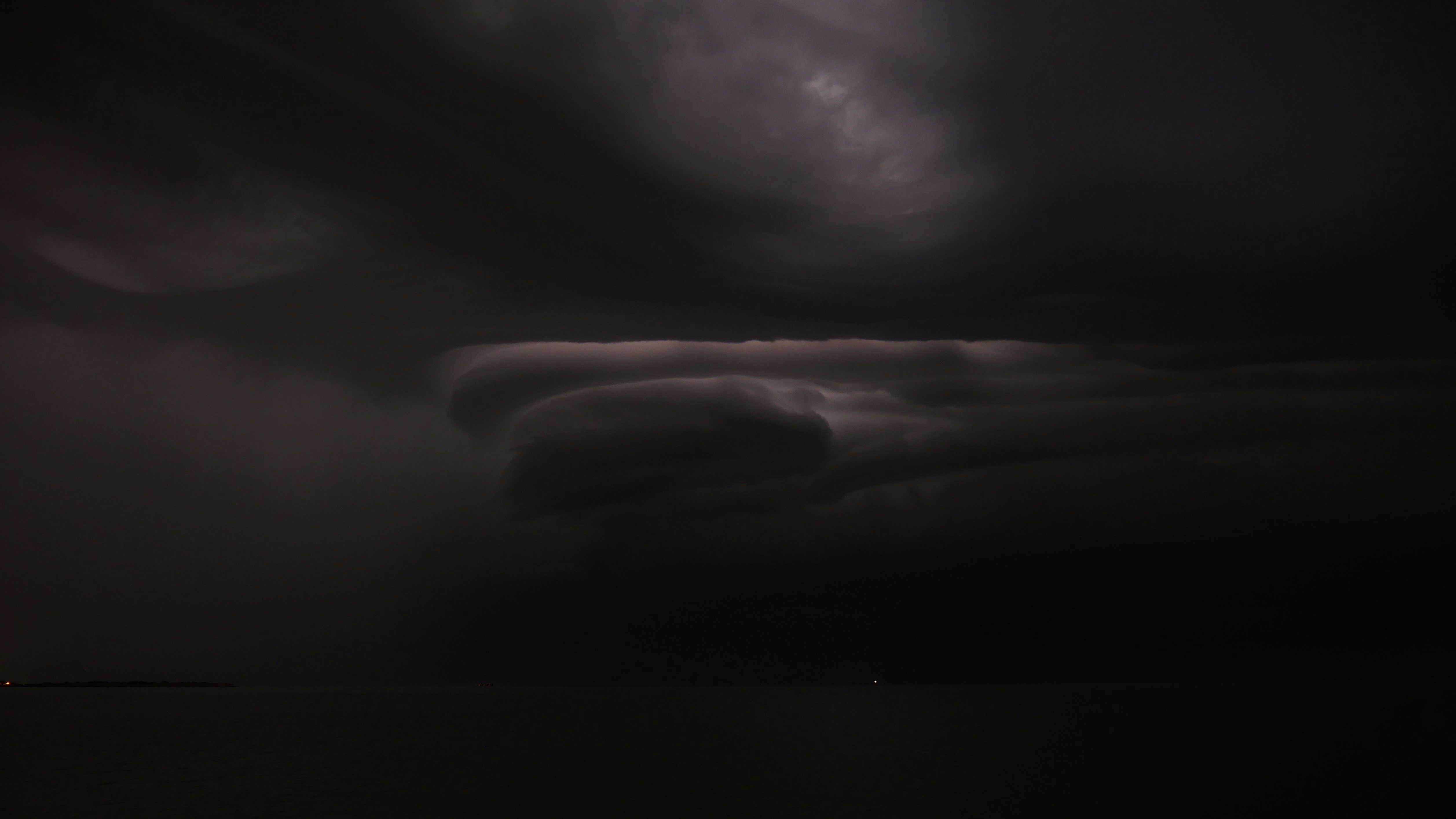 Shelf Cloud Over a Velvet Sea at Night