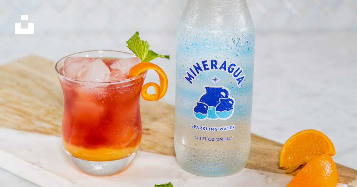 Blue Labeled Bottle Beside Clear Drinking Glass Photo Free Cold Drink