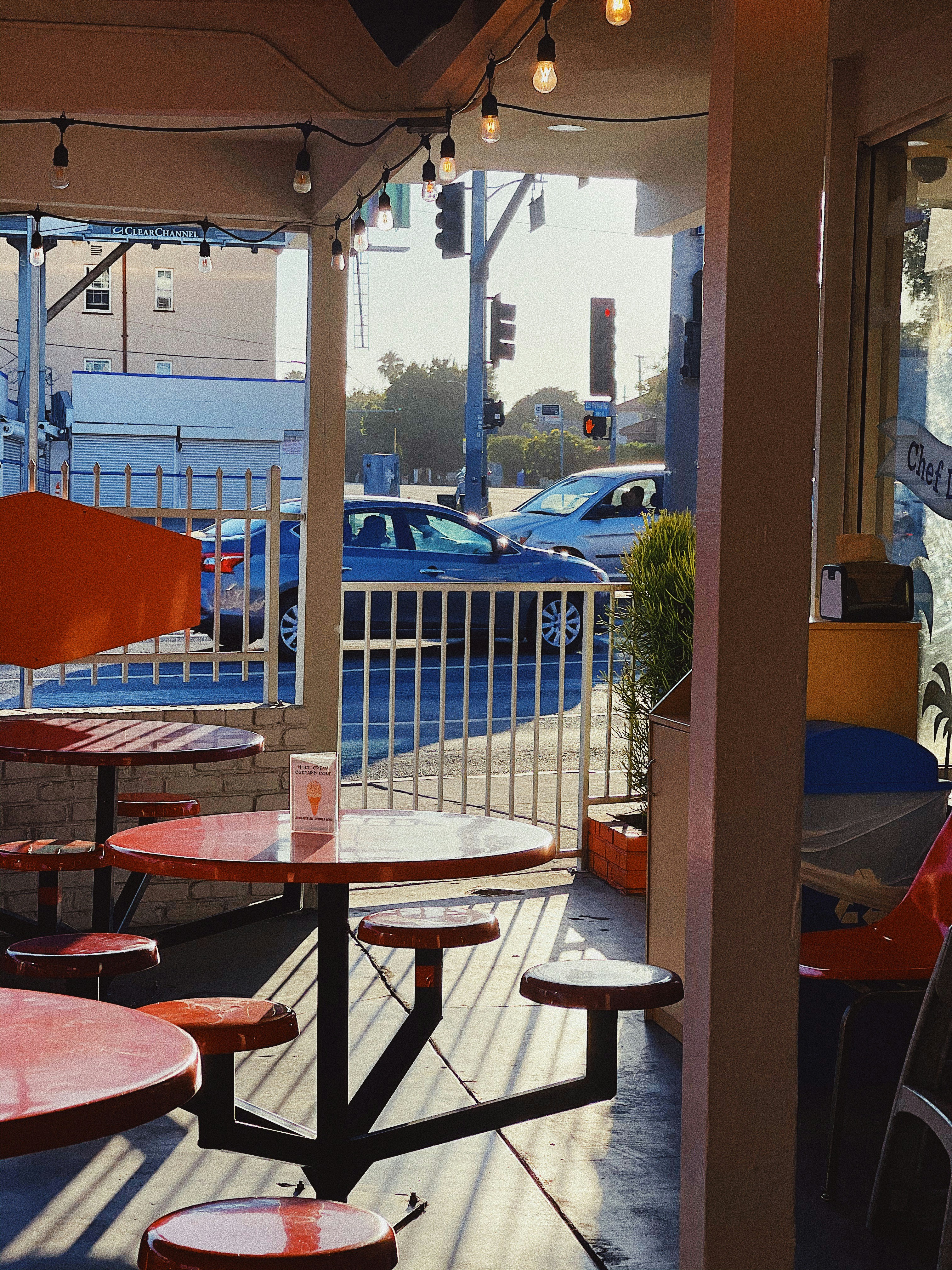 Sunlit Outdoor Café Moments with a Street View Backdrop