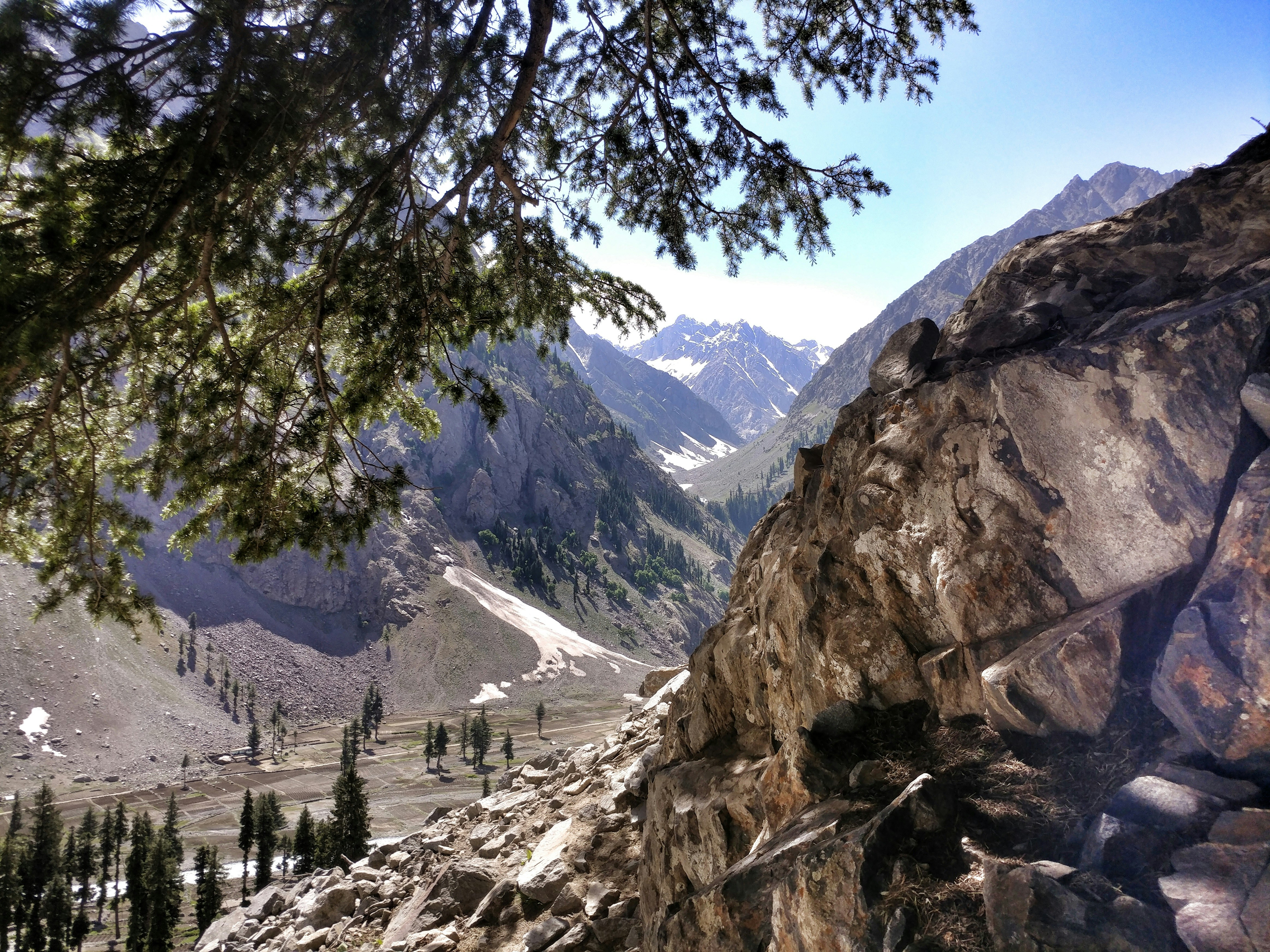 Granite Canopy Over a Snow-Threaded Alpine Valley