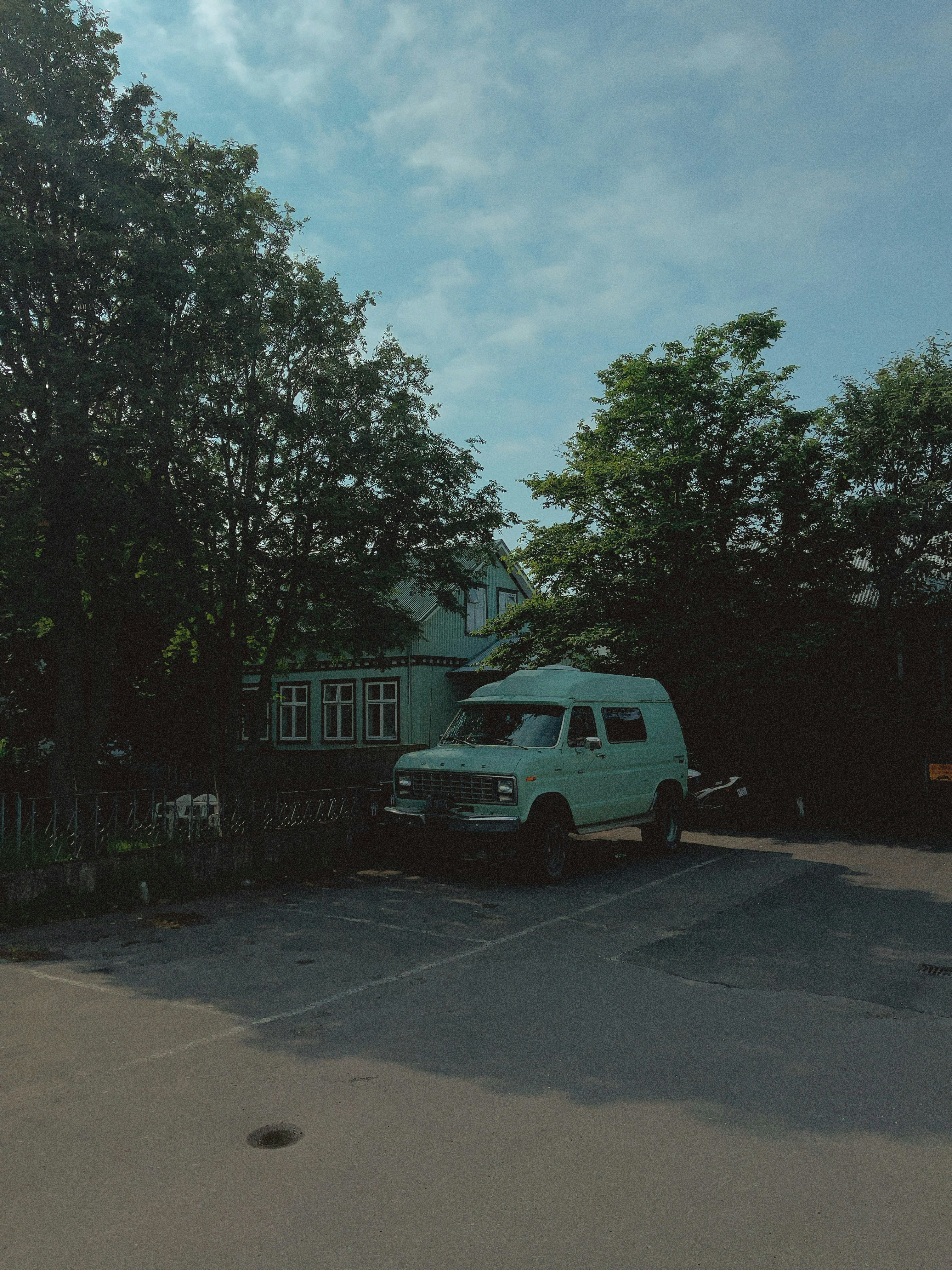 Van Under Dappled Shade: A Quiet Suburban Parking Moment