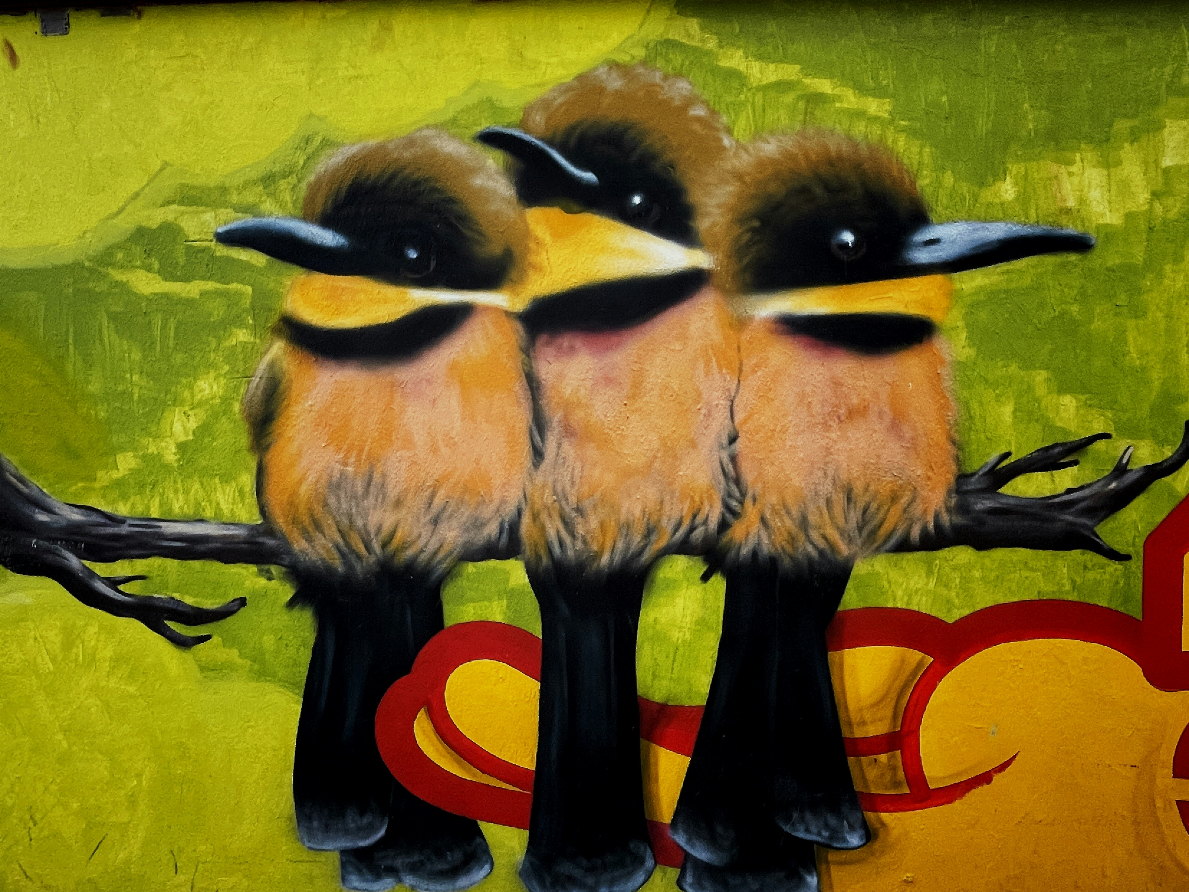 Triad of Velvet-Brown Birds on a Neon Graffiti Branch