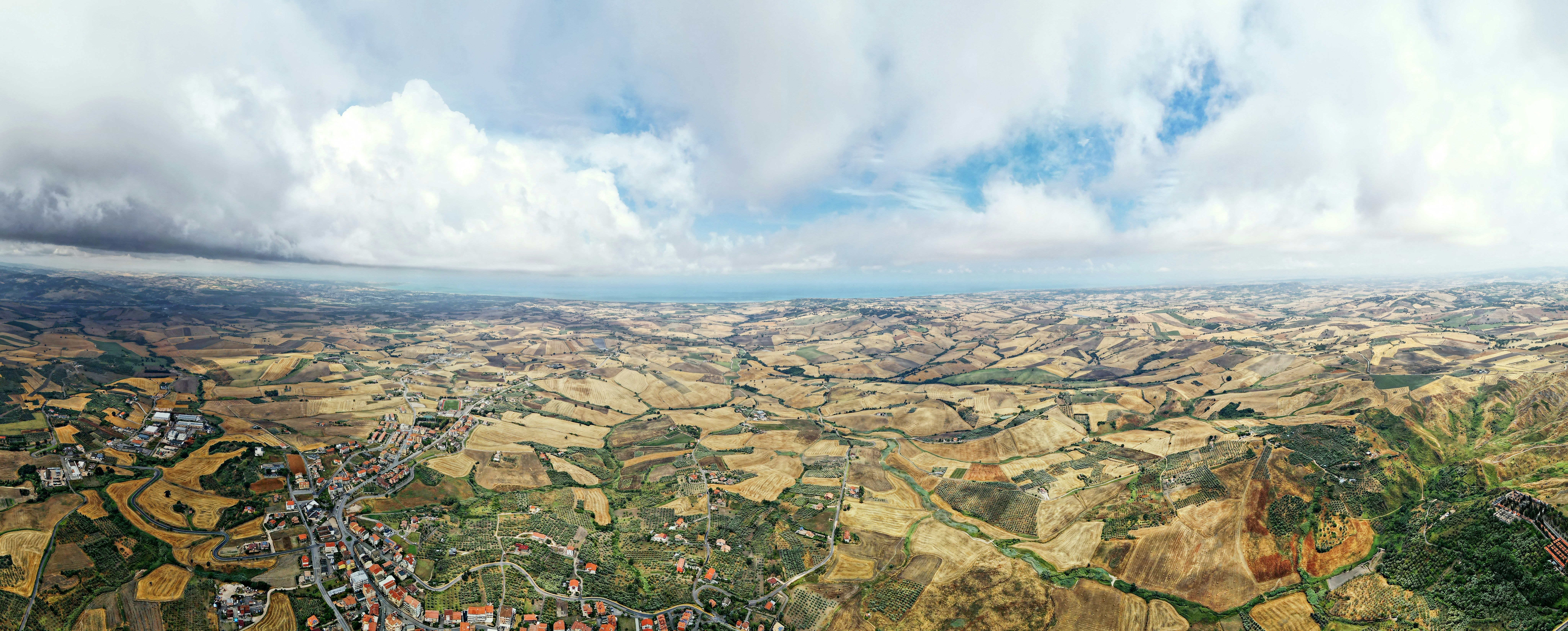 Horizon of Terraced Fields: A Panoramic Rift Over the Valley