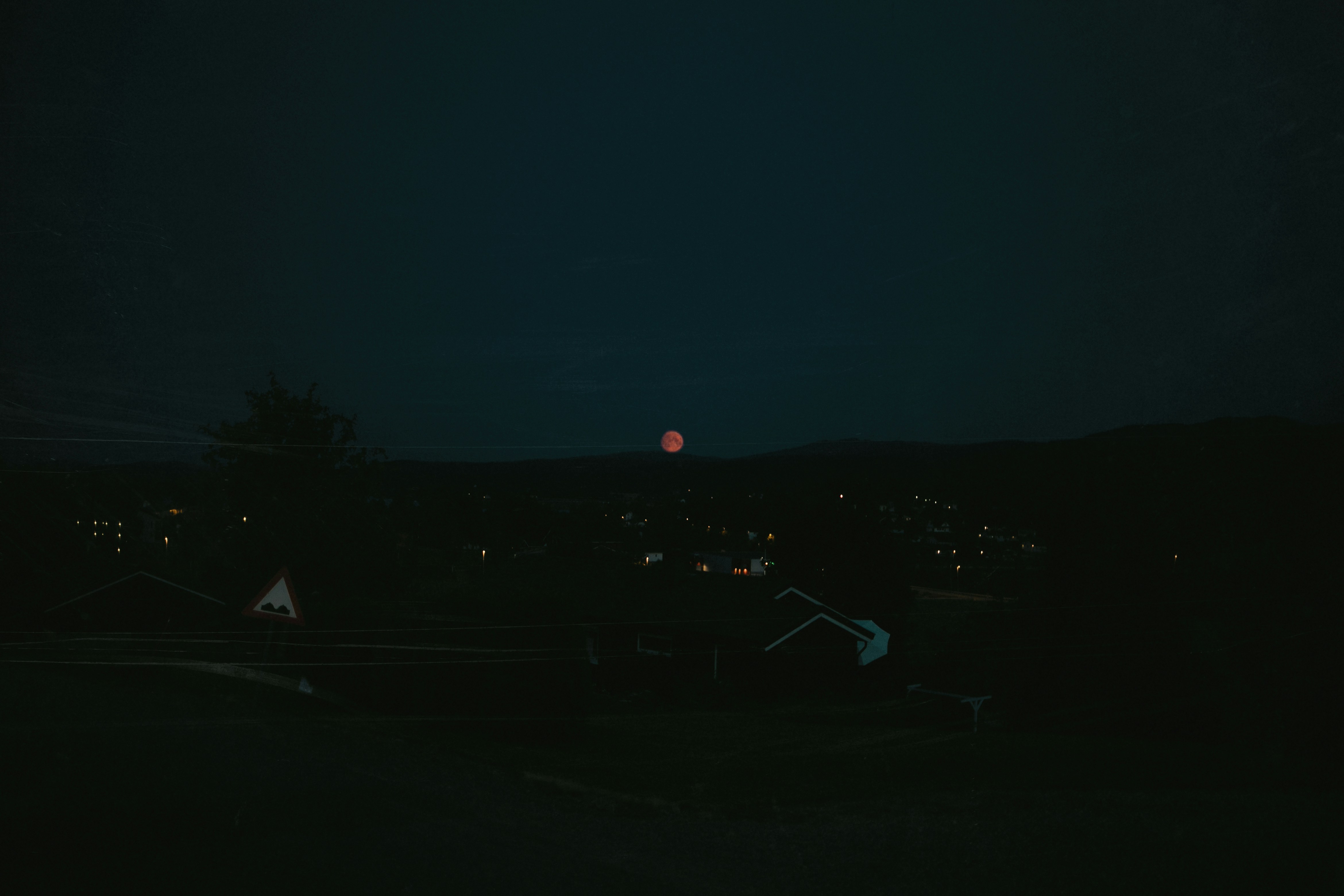 Lunar Glow Over Quiet Hills