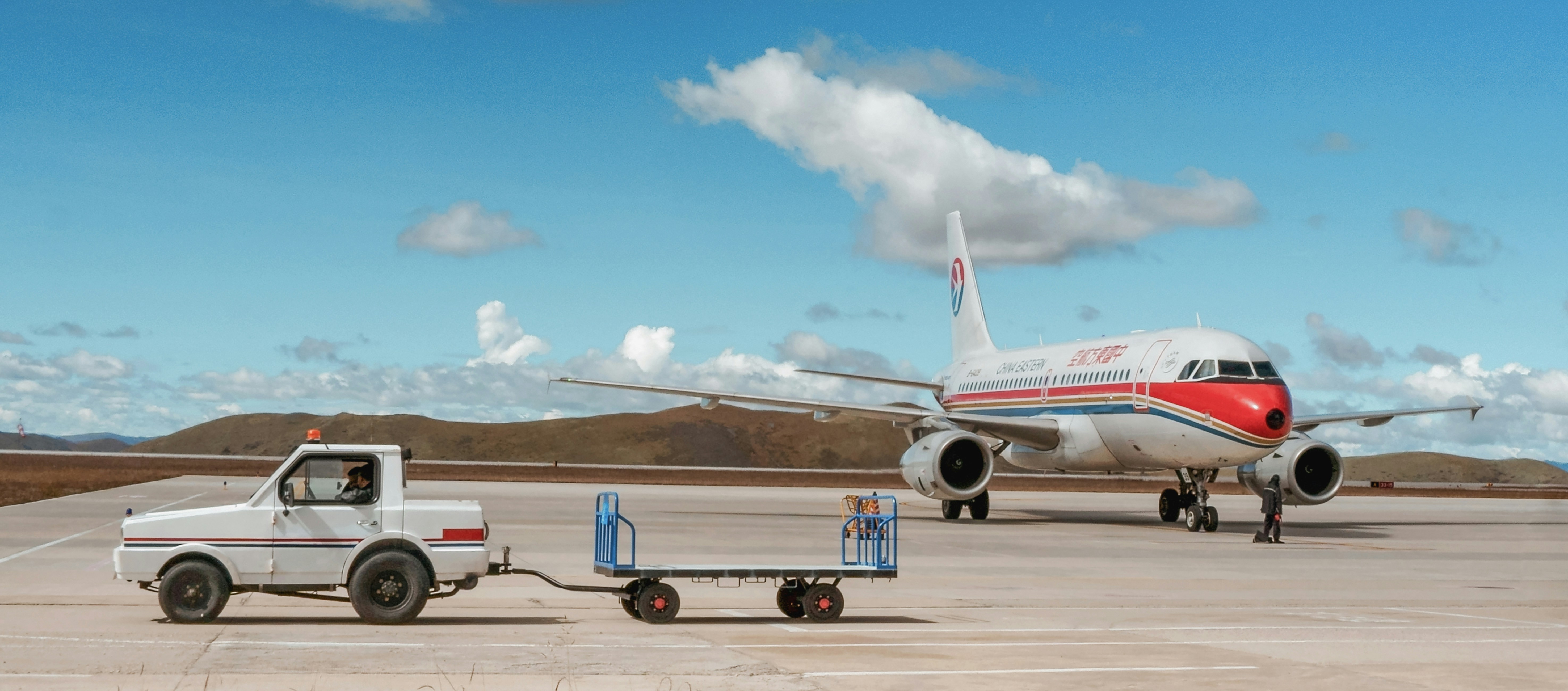Tow to the Sky: A Retro Jet on a Desert Tarmac