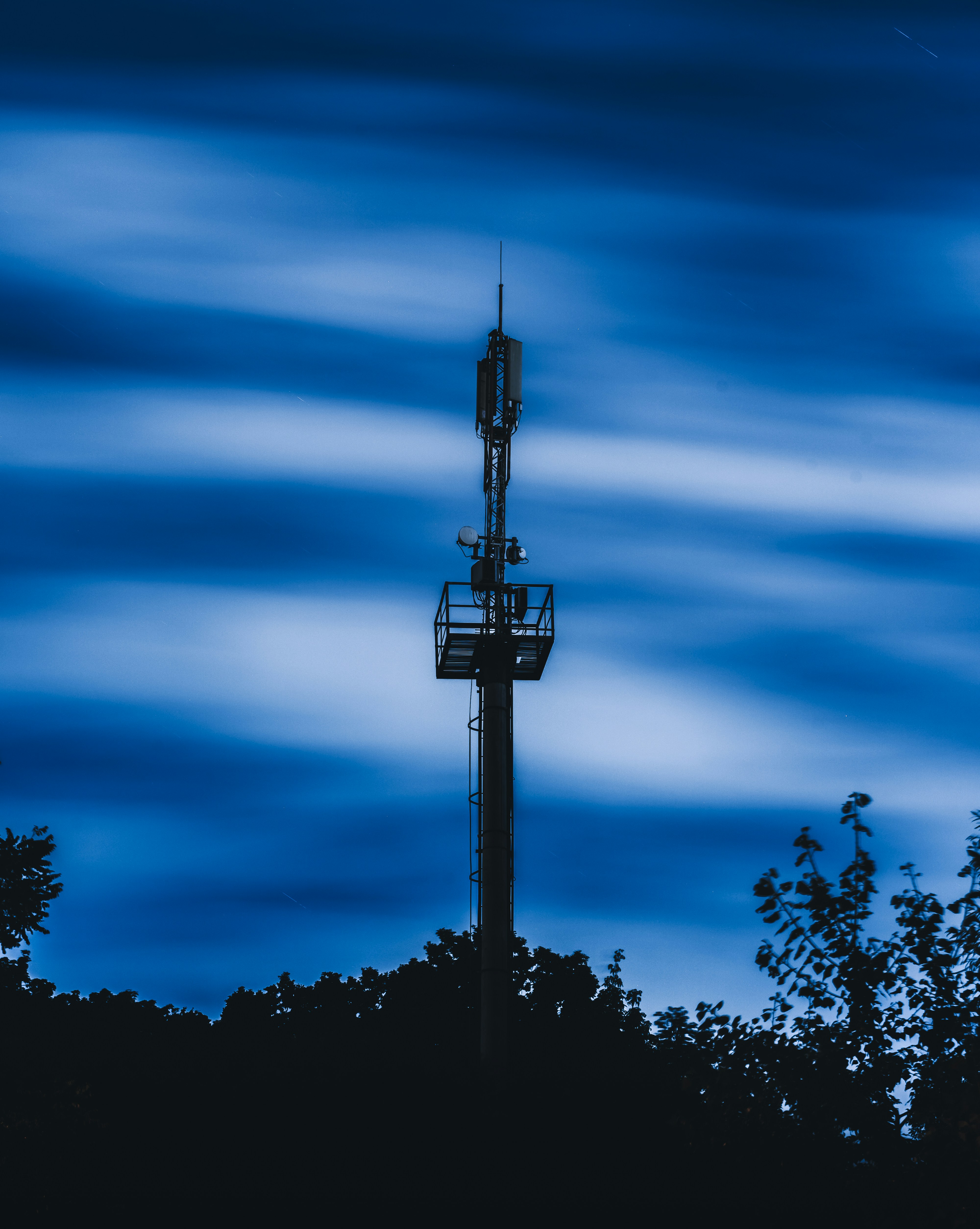 Midnight Signal: A Tower Pierces the Bluestreak Sky
