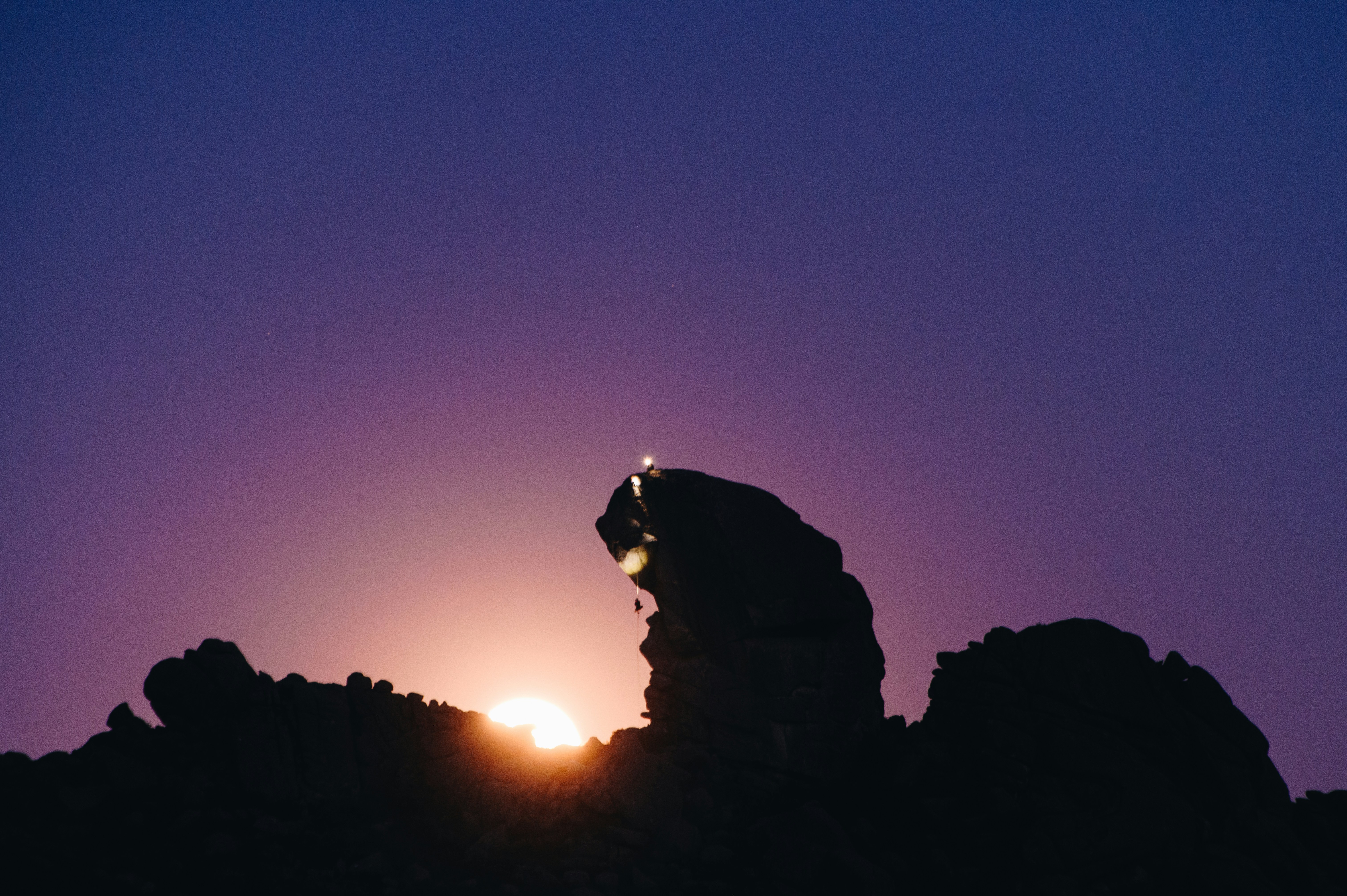 Dawn's First Silhouette: A Quiet Stone Arch at the Horizon