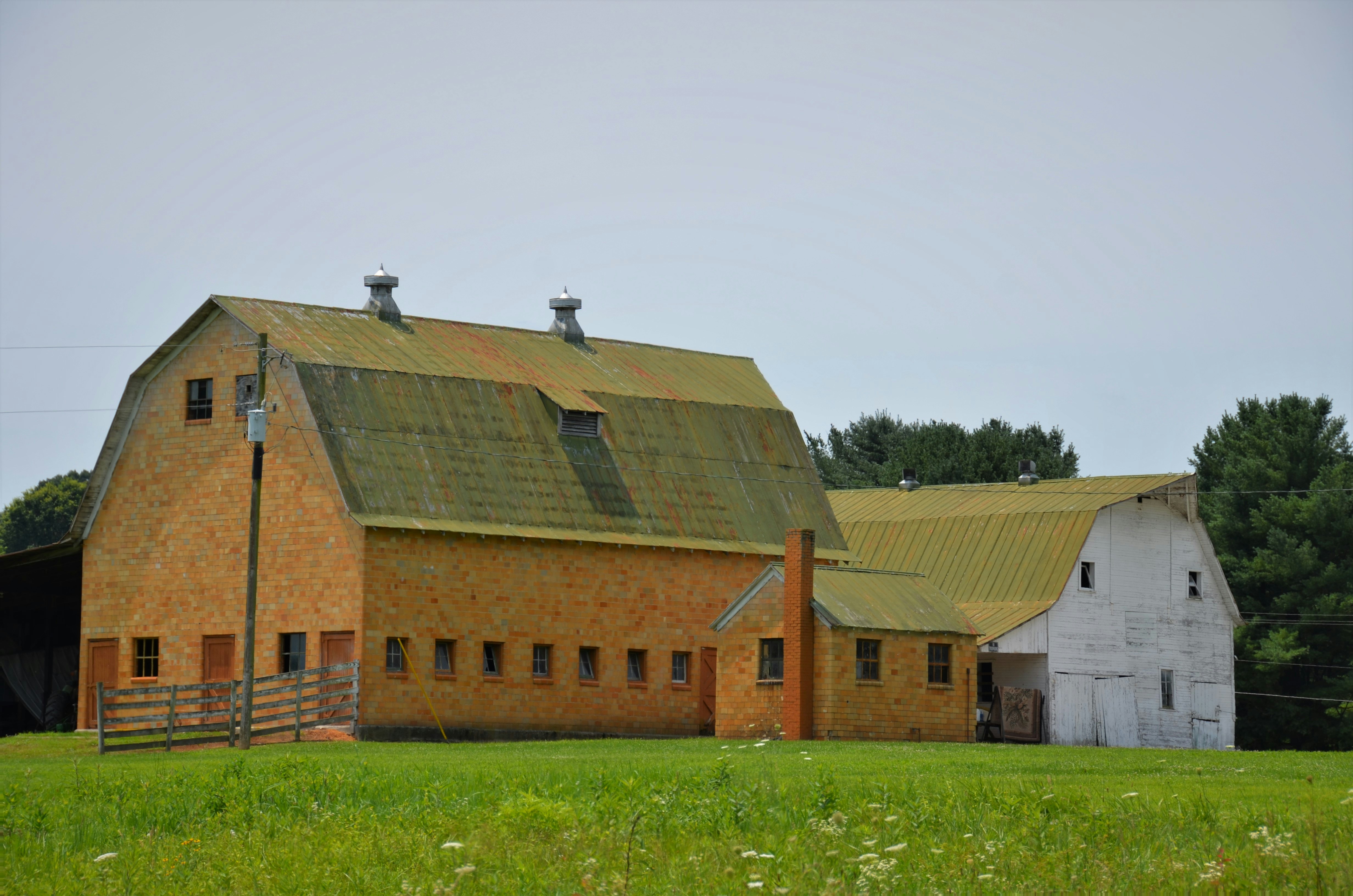Large glazed brick barn and shed
