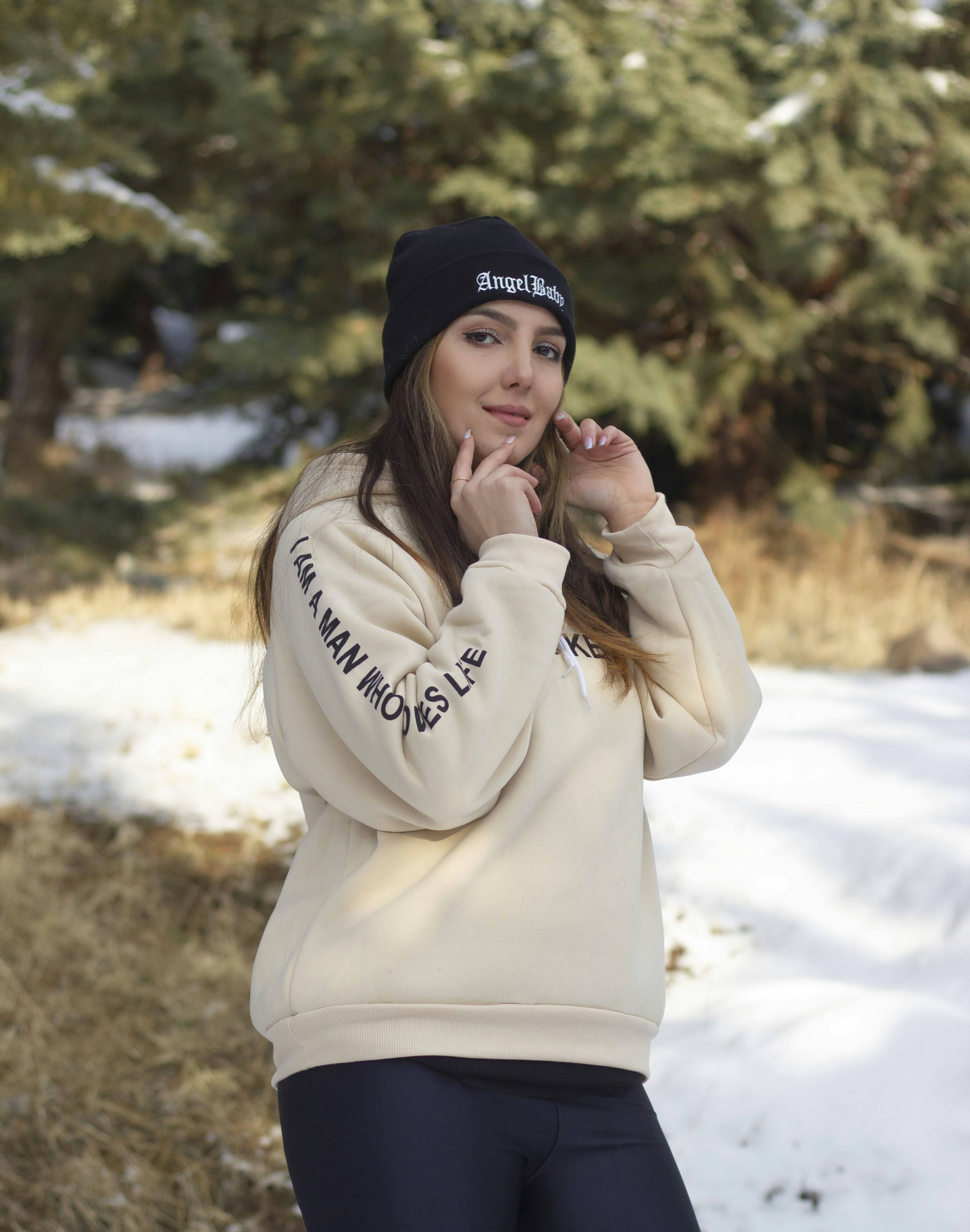 Snowlit Contemplation: A Quiet Portrait Amid Pine Shadows