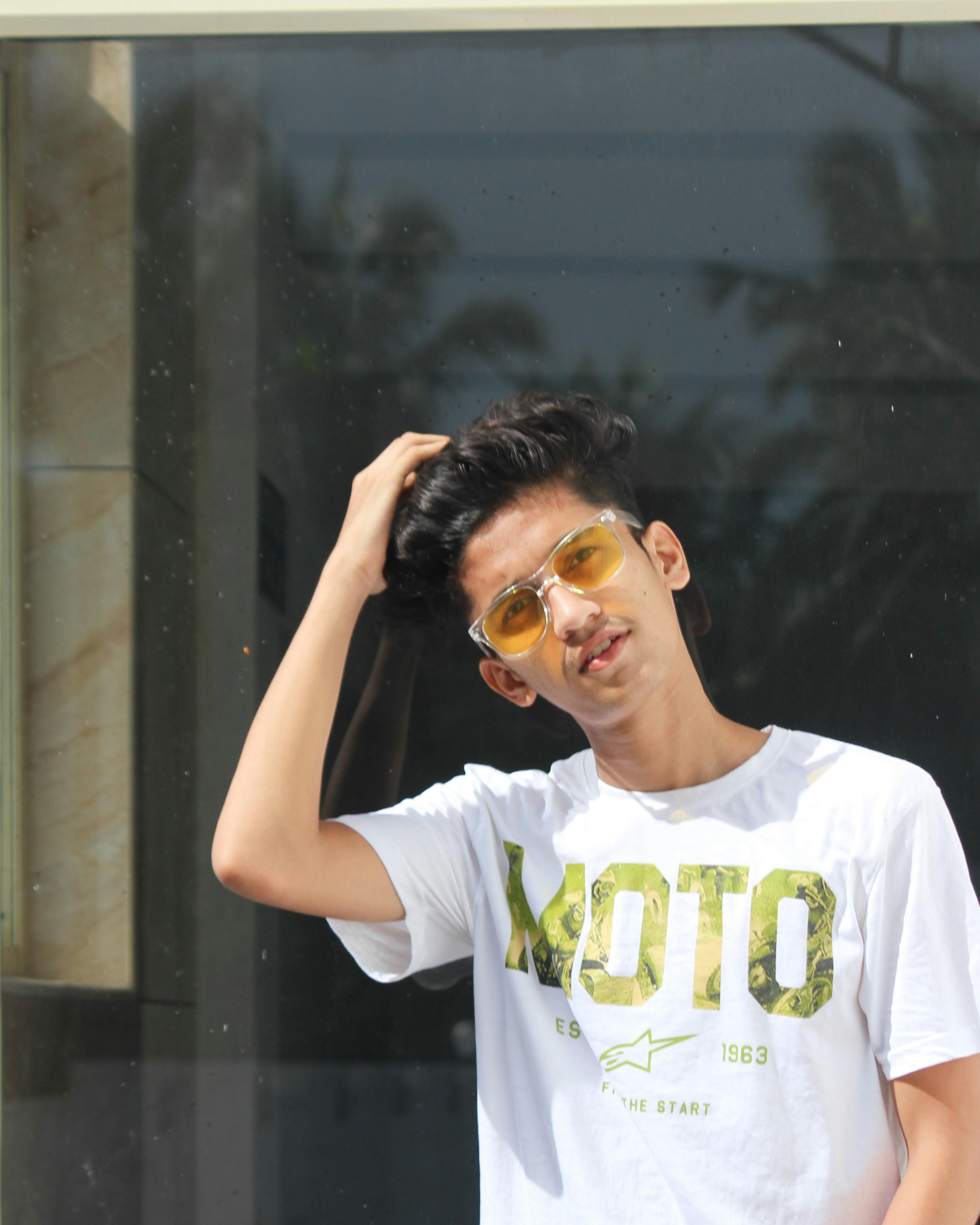 Sun-kissed Gaze: A Casual Portrait in Golden Lenses